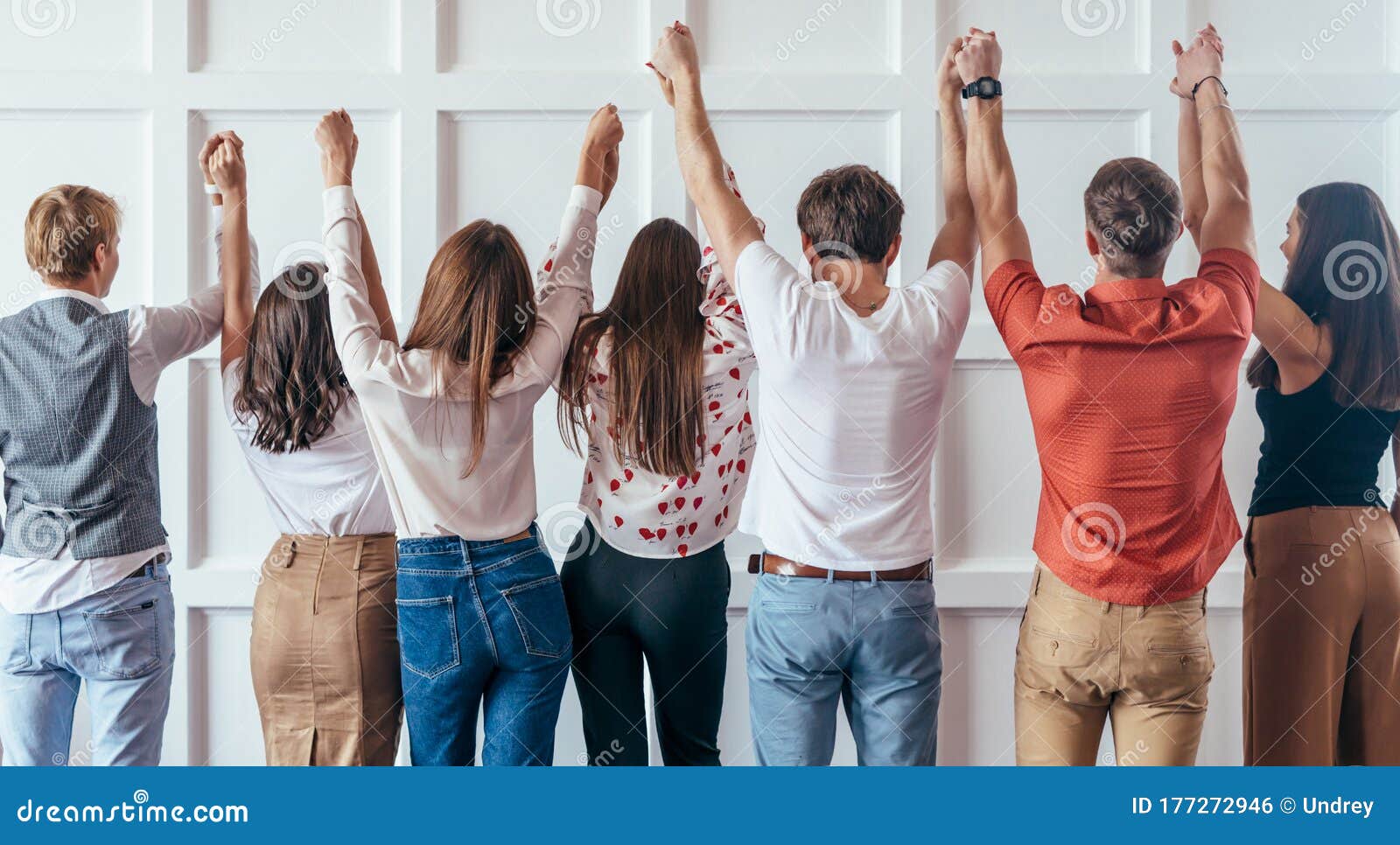 Back View of People Holding Hands. Together, we are Stronger Stock ...