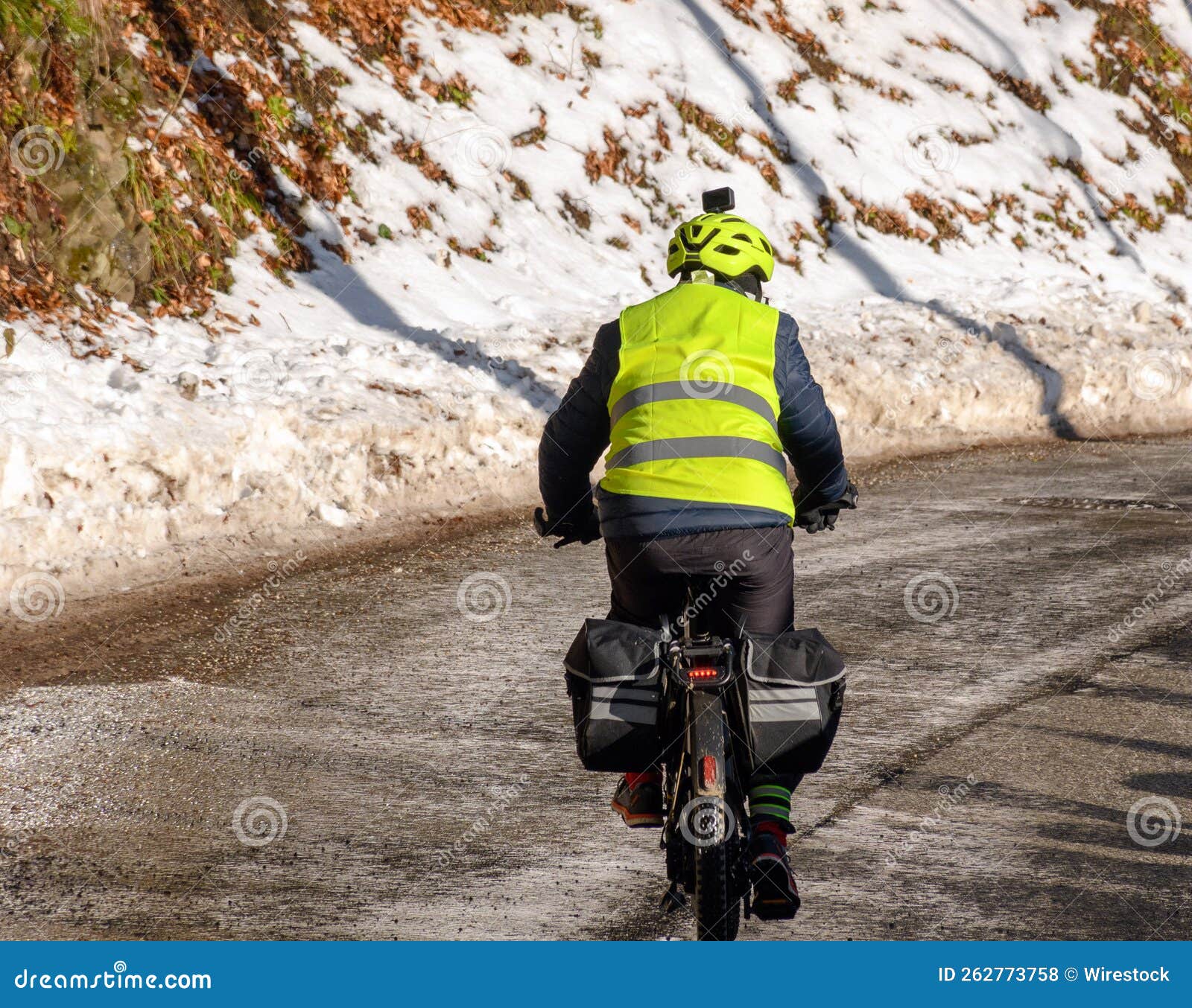 Back View of a Person on a Bicycle Riding Down a Mountainside Road ...
