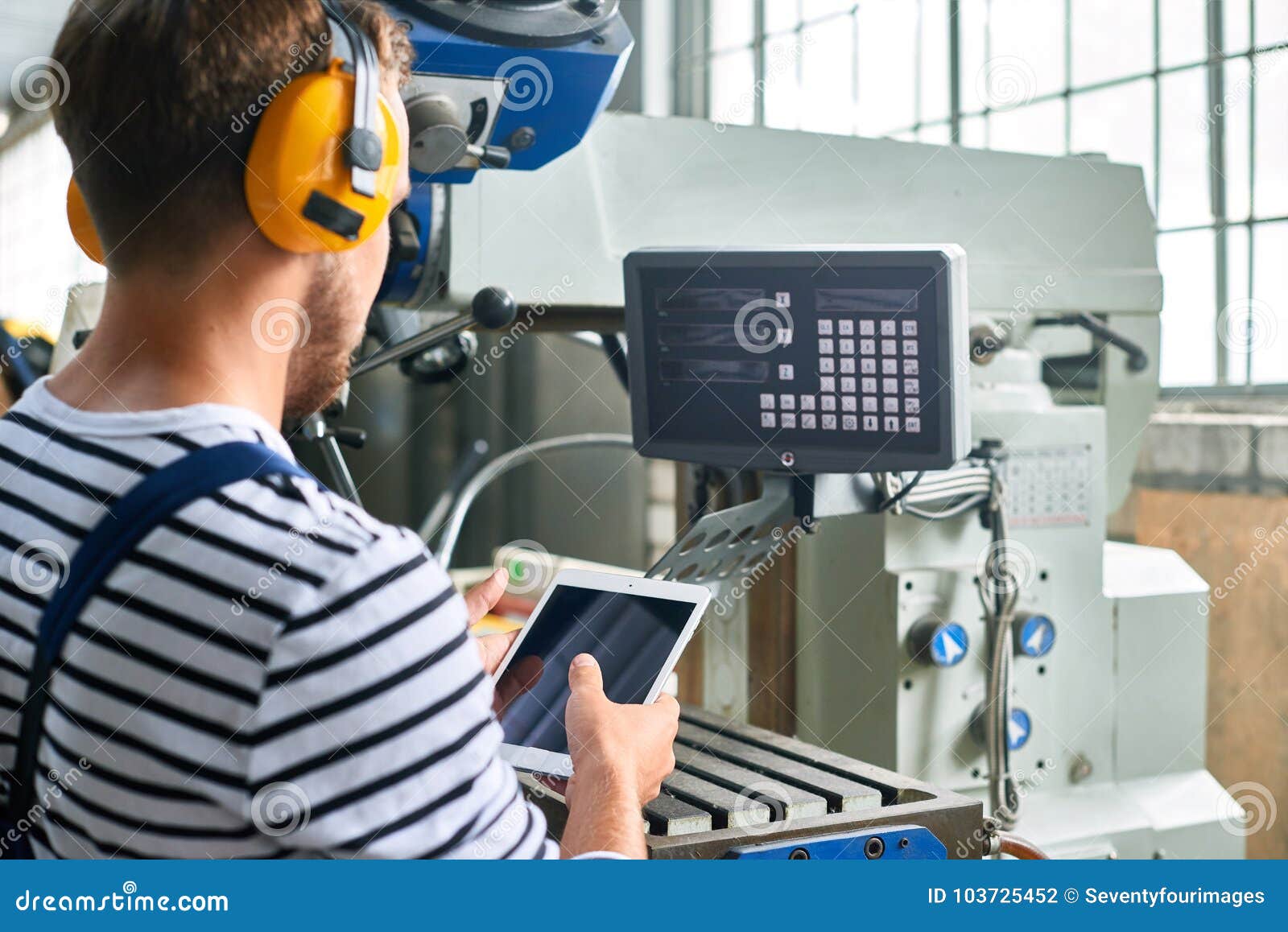 Modern Machine Operator at Factory Stock Photo - Image of modern ...