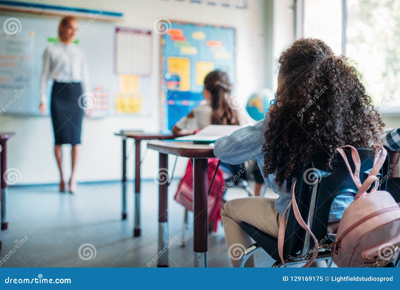 Back View of Pupils Sitting on Lesson in Class and Looking Stock Image ...