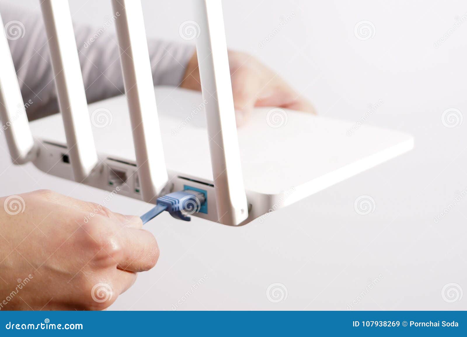 The Back View of Router Showing the Lan Internet Port, and the Hand is ...