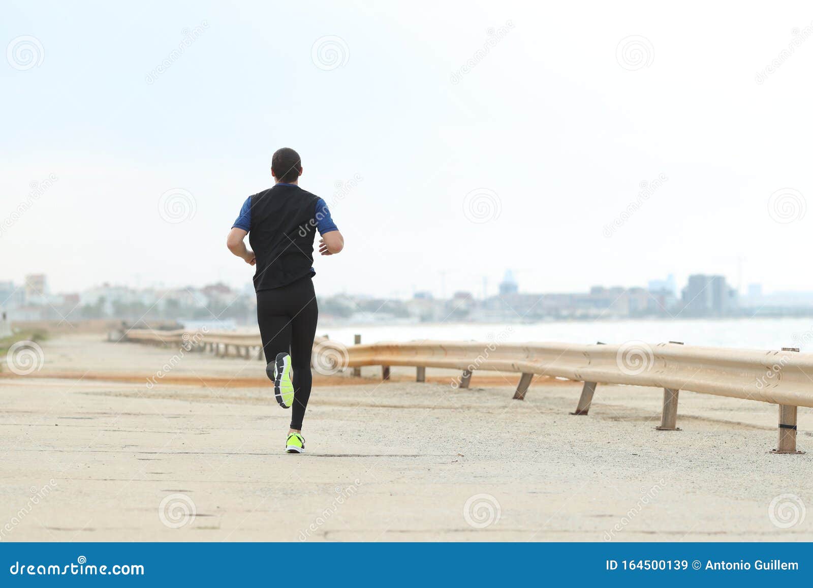 Back View of Runner Jogging on the Beach Stock Image - Image of camera ...