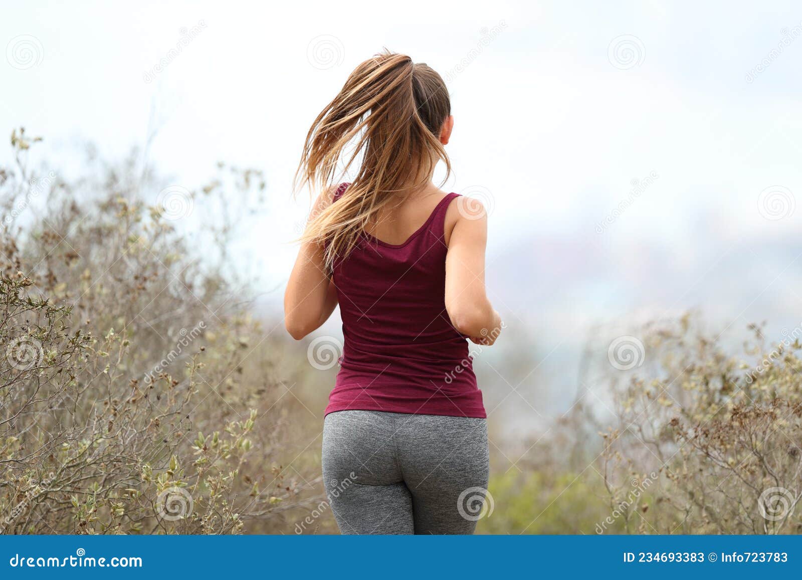 Back View of a Runner that is Running in the Mountain Stock Image ...