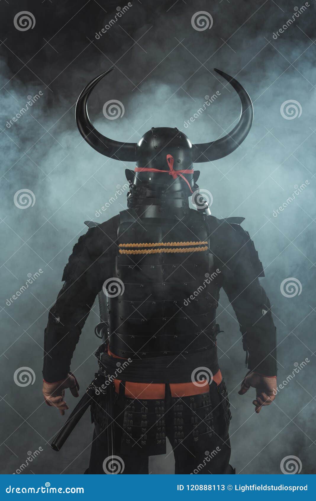 Back View of Samurai in Traditional Armor and Horned Helmet on Dark ...