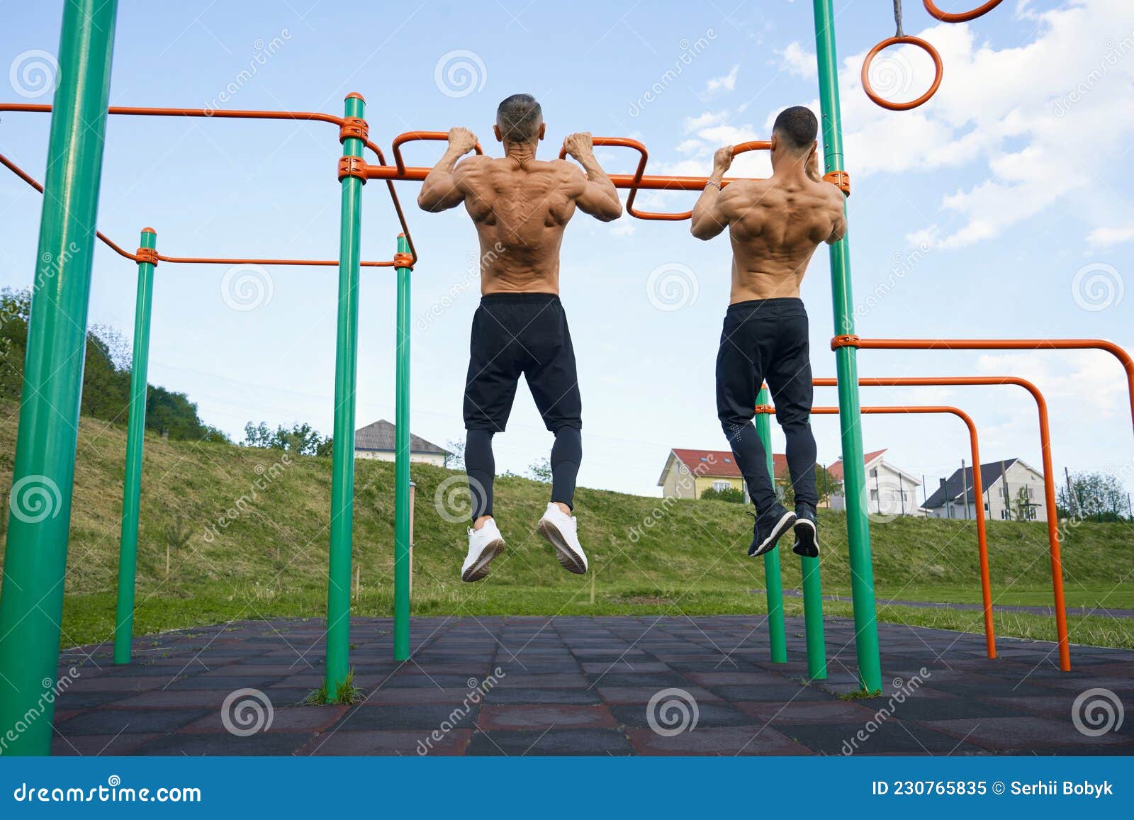 Back View of Shirtless Bodybuilders Doing Pull Ups Outdoors Stock Image ...