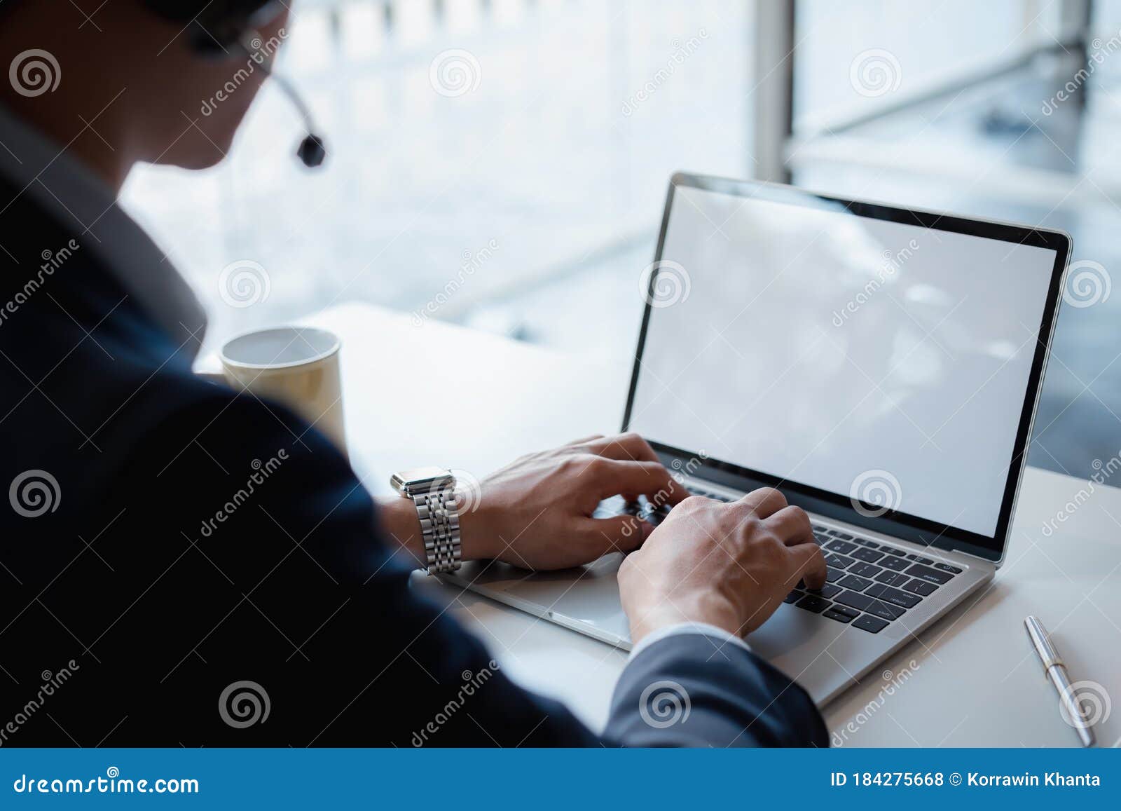 Back View Shot of Call Center Agent in Headset Consulting Client and ...