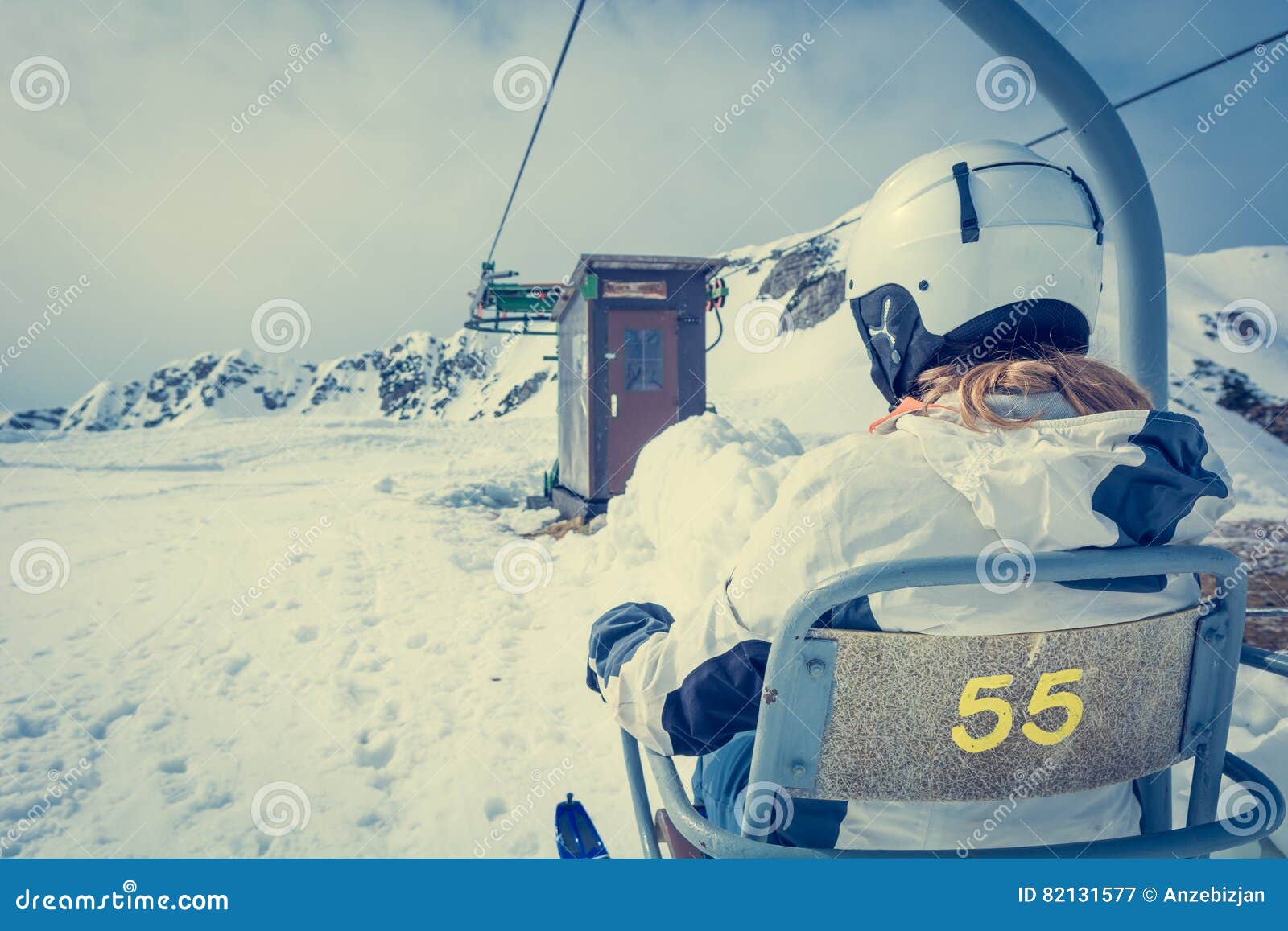 Back View of Skier Riding a Lift. Stock Image - Image of sitting ...