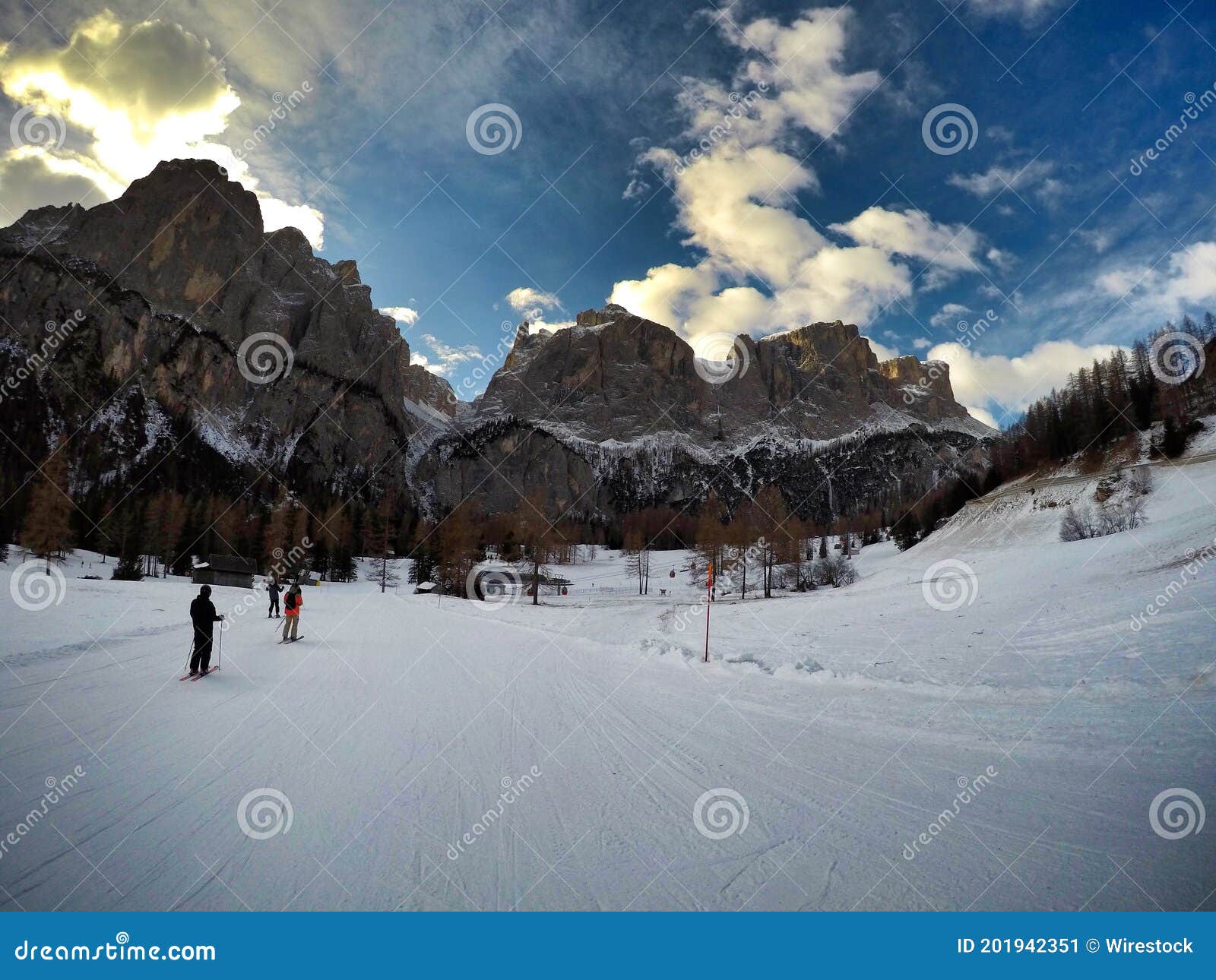 Back View of Skiers Skiing on a Snow-covered Landscape with Immense ...