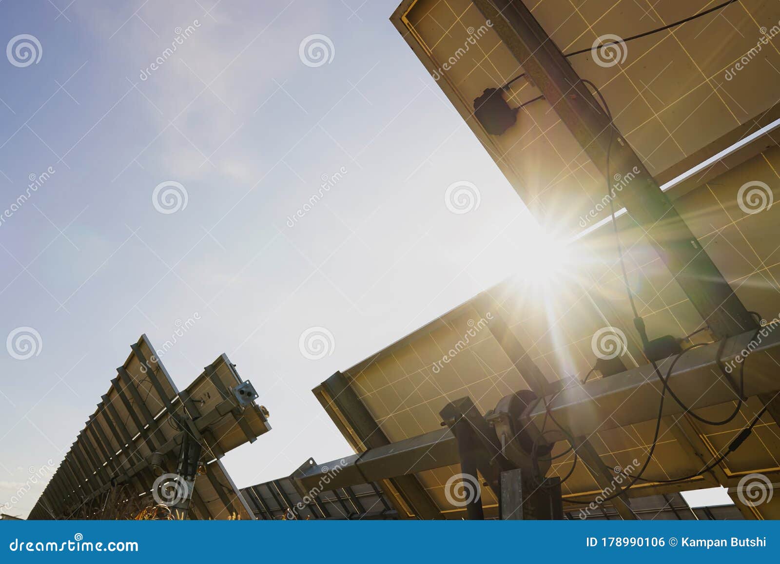 Back View of the Solar Farmsolar Panel with Sun in Background ...