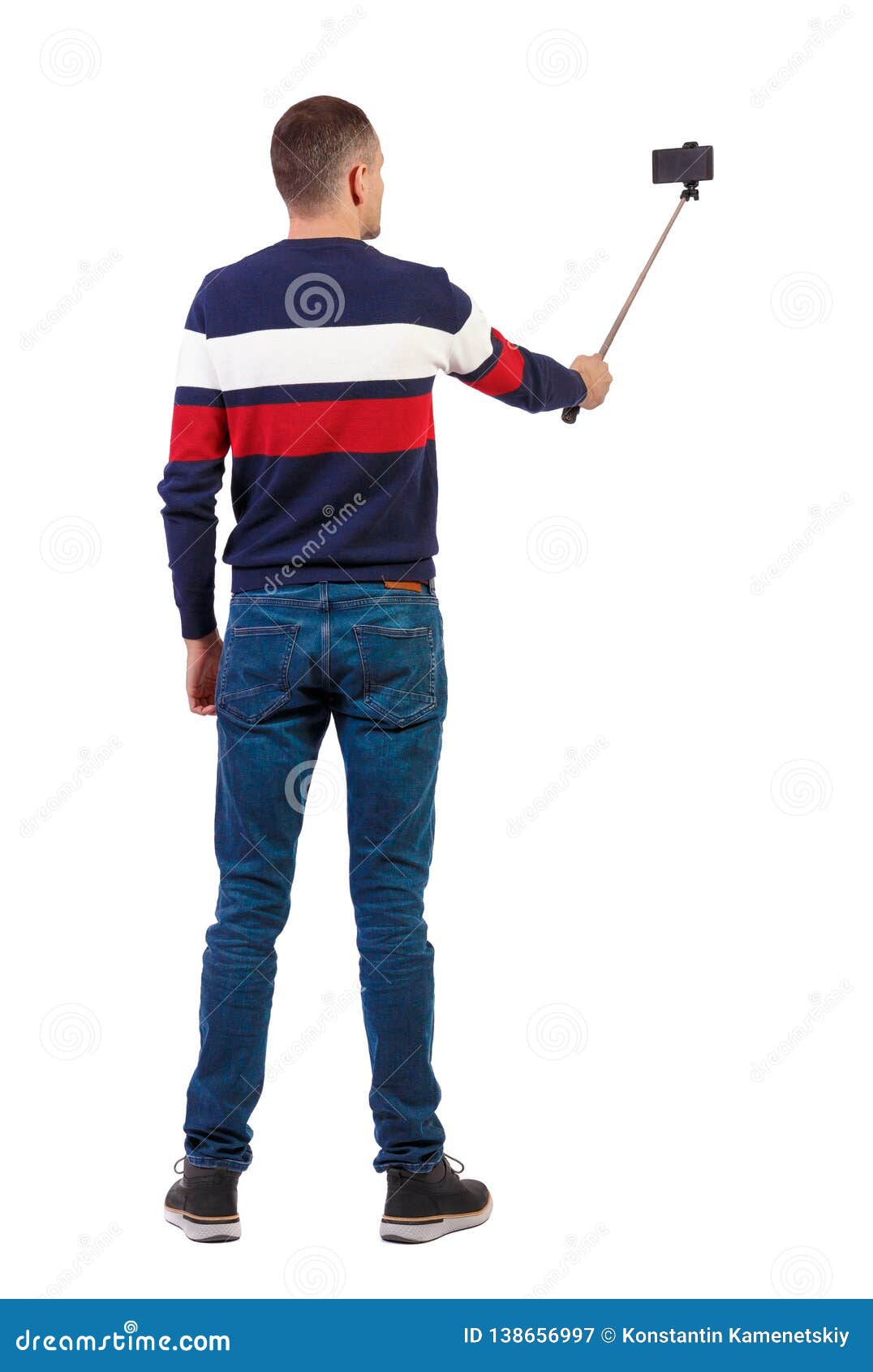 Back View of Standing Young Guy with Smartphone in the Hands of Stock ...