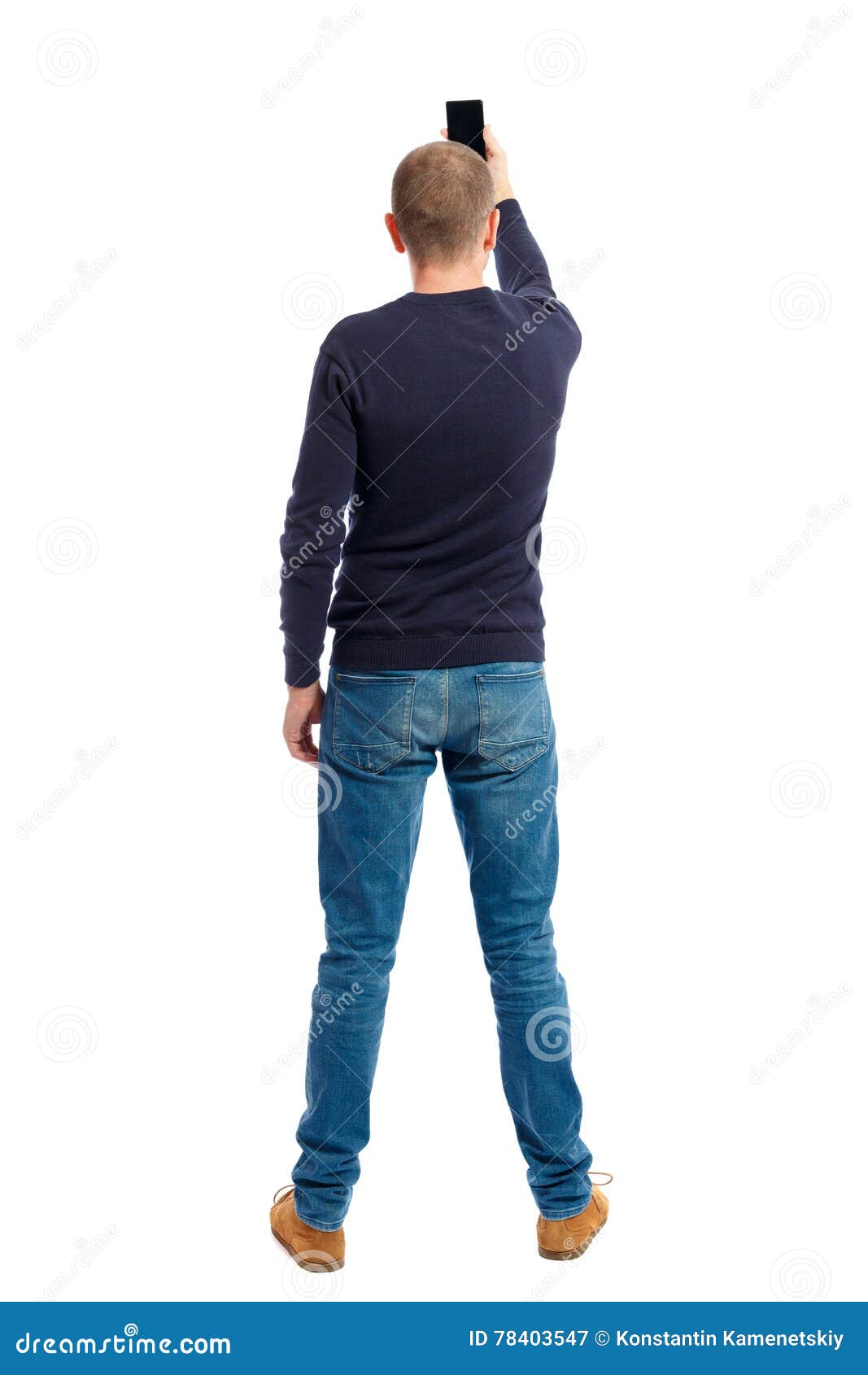 Back View of Standing Young Man and Using a Mobile Phone. Stock Image ...