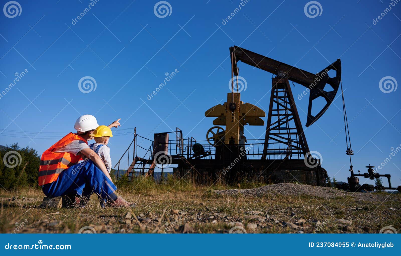 Oilman Showing Little Boy at Oil Extraction Station. Stock Image ...