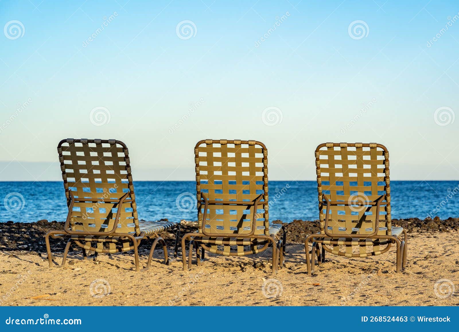 Back View of Three Beach Chairs on a Sunny Seashore Stock Image - Image ...