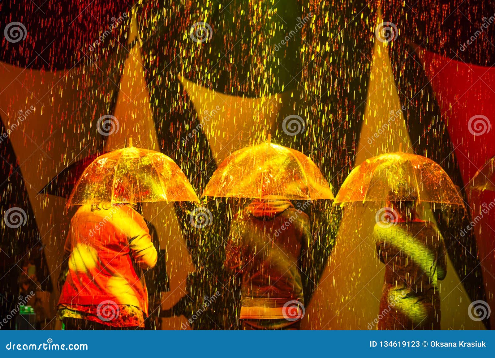 Back View Three Persons with Umbrellas Under Artificial Rain Coming ...