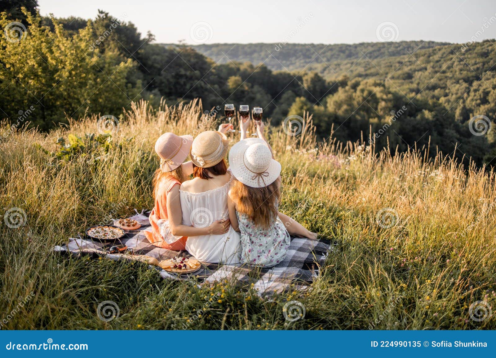 Back View Of Three Young Female Friends Having Fun Drink Red Wine And