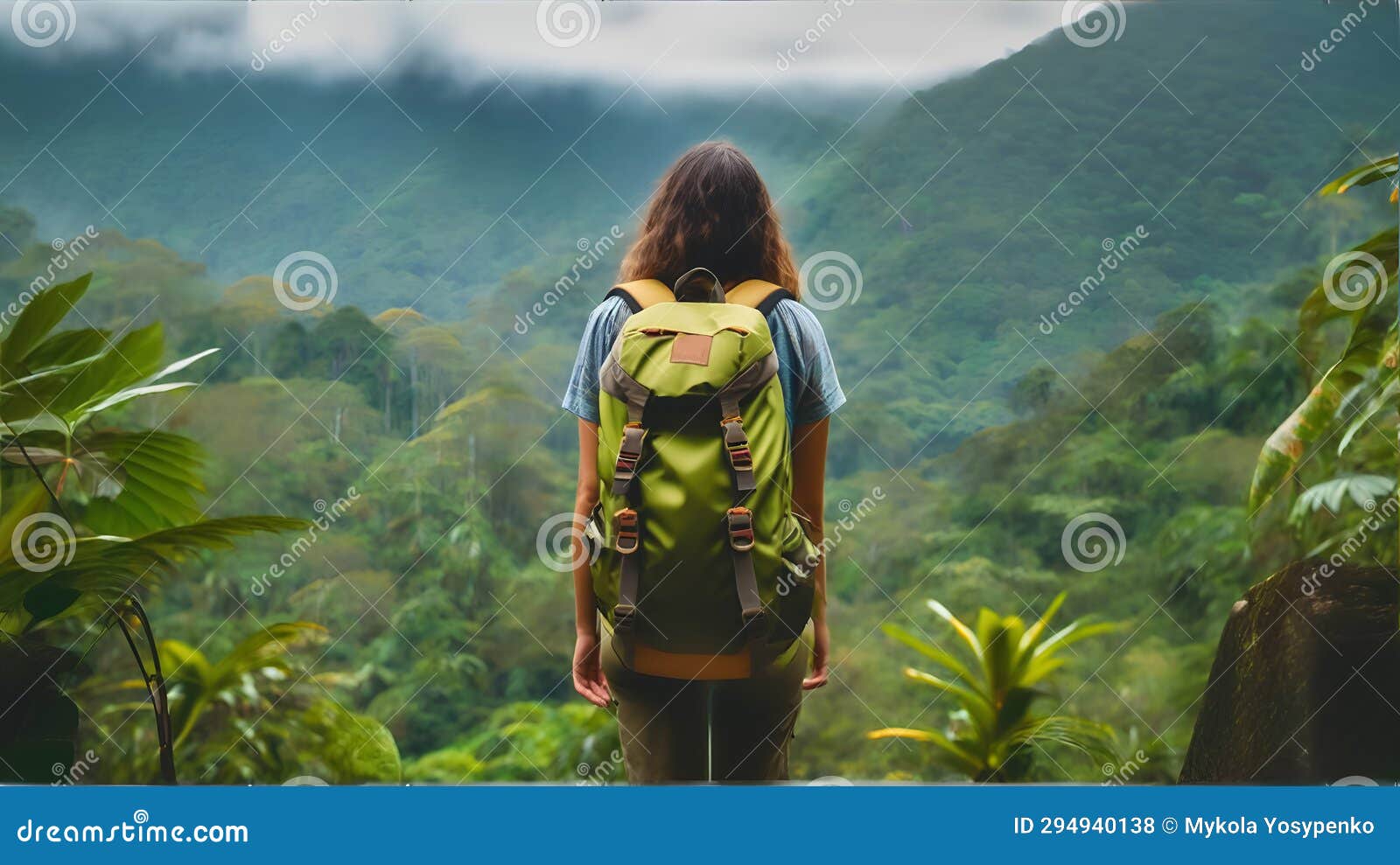 Back View of a Tourist with a Backback, Blurred Distant Rainforest and ...
