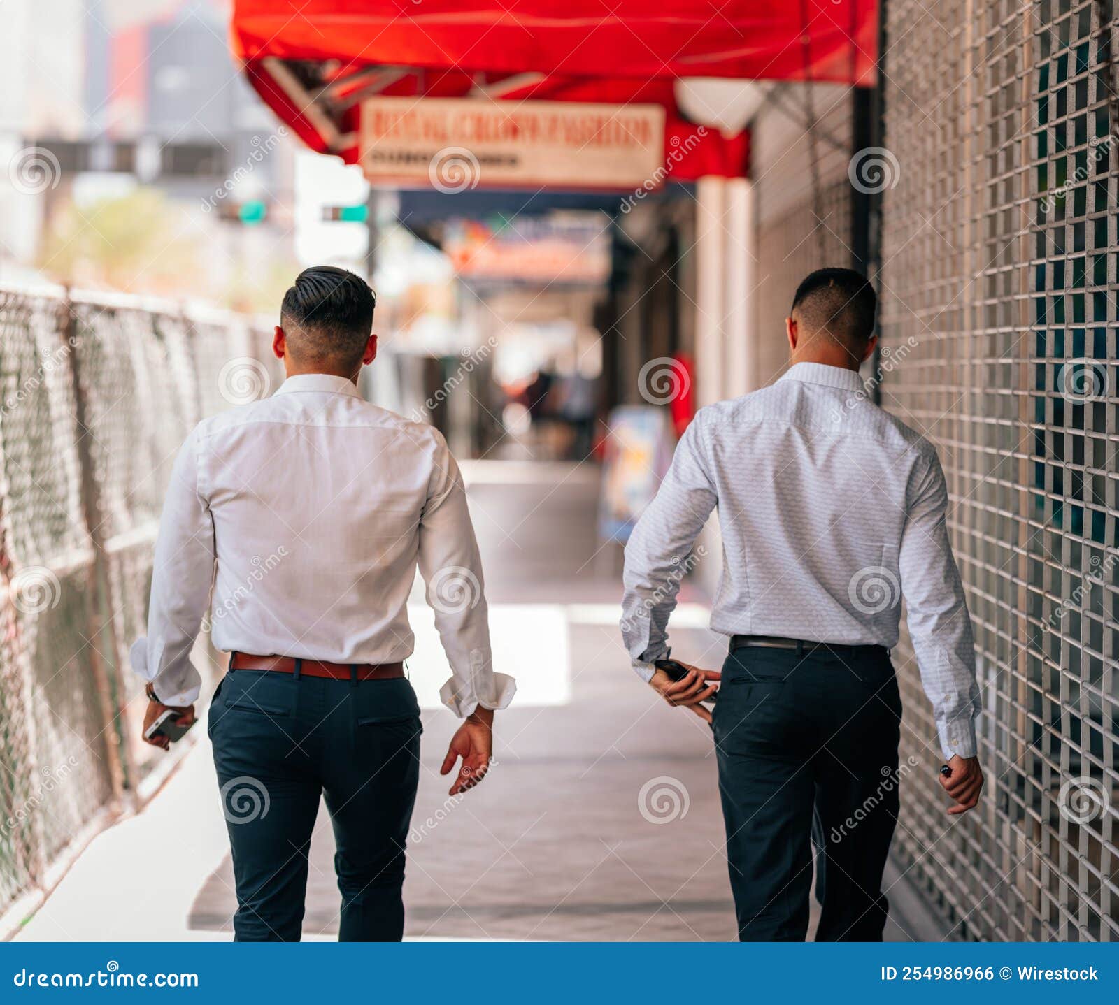 Back View of Two Businessmen Walking on a Sidewalk Stock Photo - Image ...