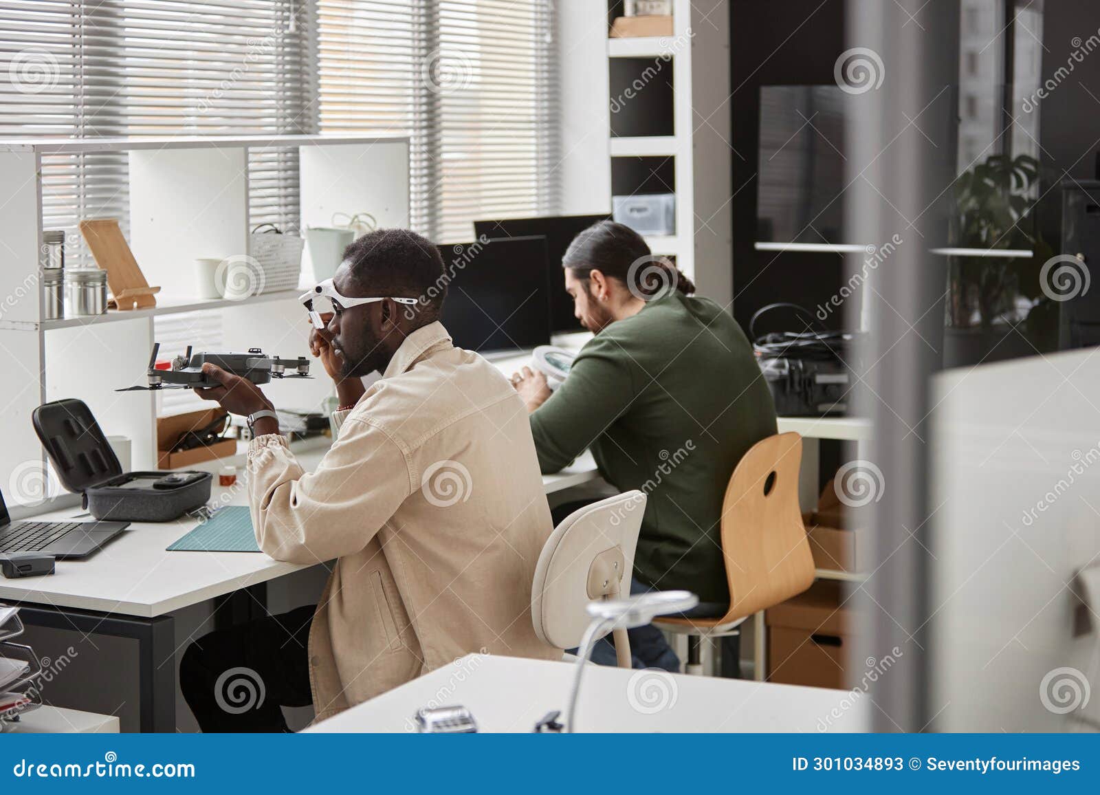 Back View at Two People Fixing Electronics in Tech Repair Shop Stock ...