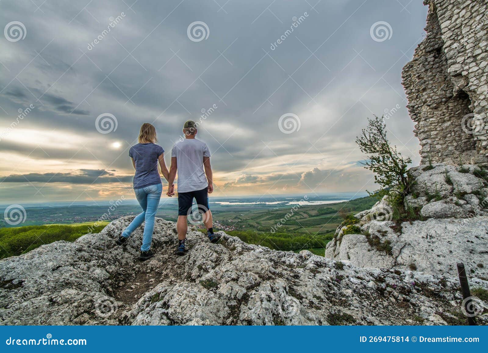 Back View of Two People Looking at Greenery Field Stock Photo - Image ...