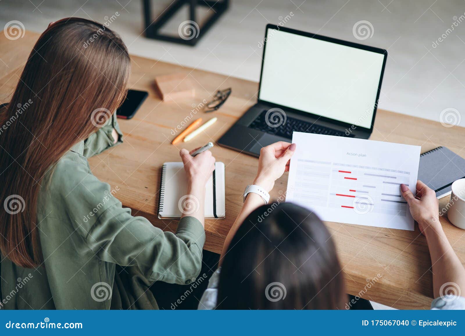 Back View of Two Young Woman Working in Modern Office Using Laptop and ...