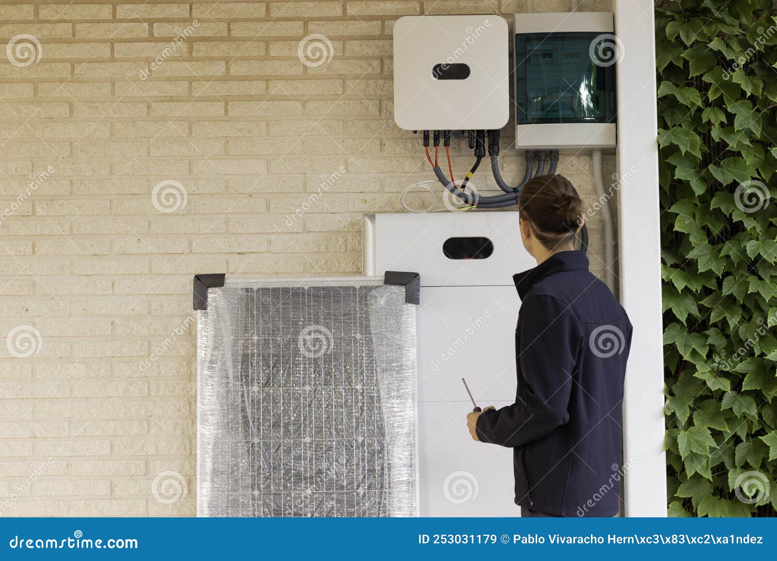 Back View of Unrecognizable Young Man Technician Installing a Solar ...