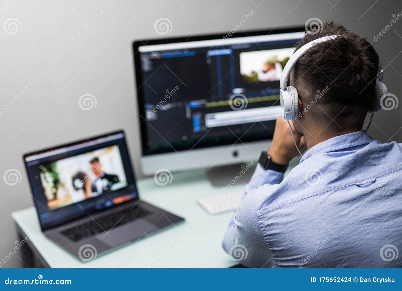 Back View of Video Editor Using Computer Working with Fotoage at His ...