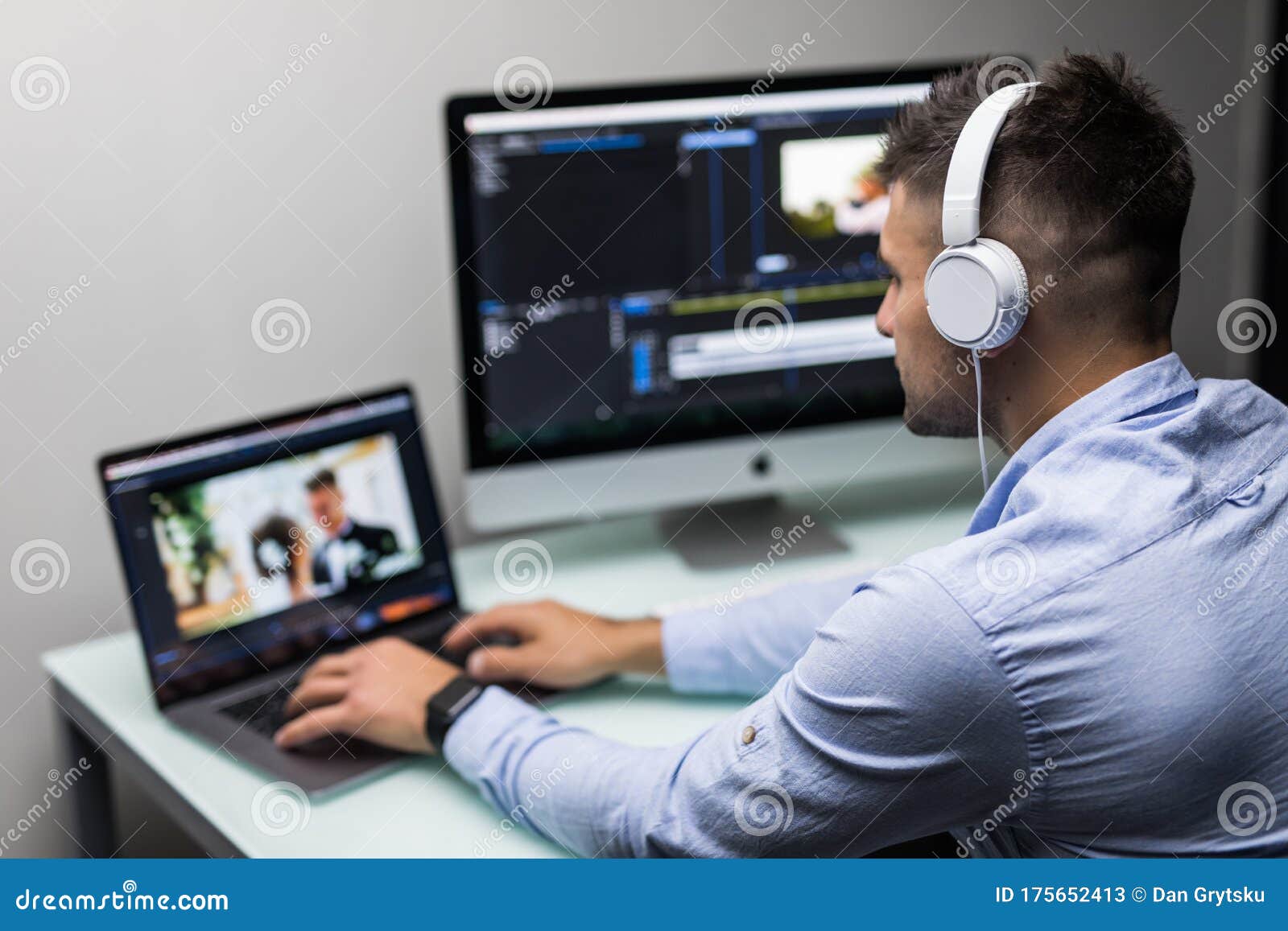 Back View of Video Editor Using Computer Working with Fotoage at His ...