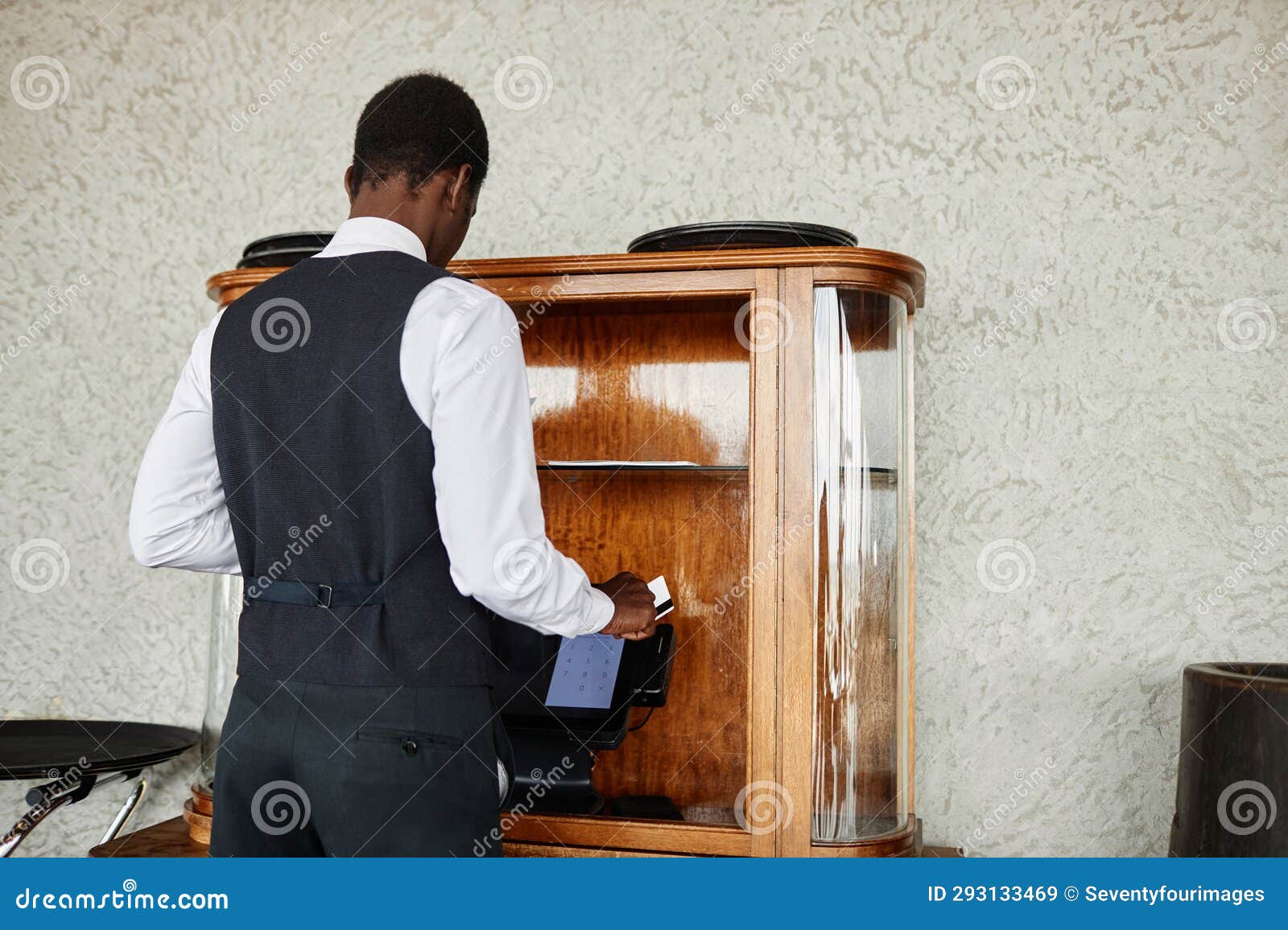 Back View of Waiter Using Computer System in Restaurant and Putting ...