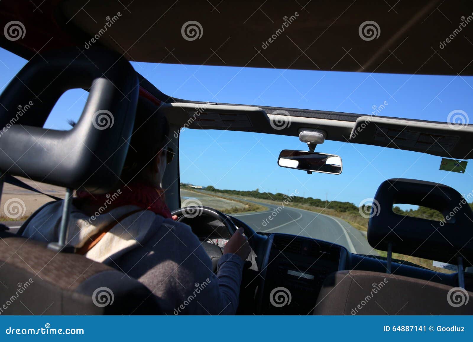 Back View of Woman Driving Car on Empty Road Stock Image - Image of ...
