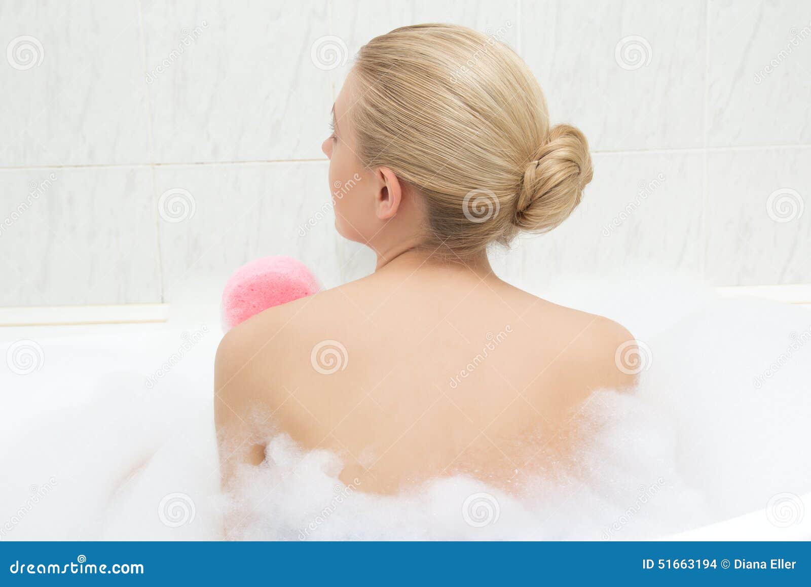 Back View of Woman Relaxing in Bath and Washing Herself Stock Photo ...