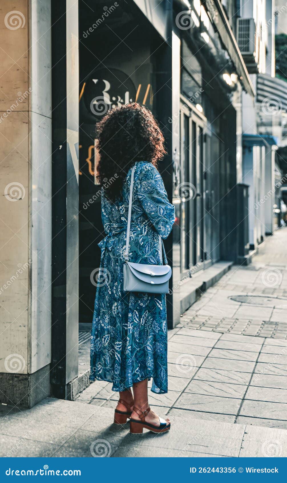 Back View of a Woman Standing Outside the Building Stock Photo - Image ...