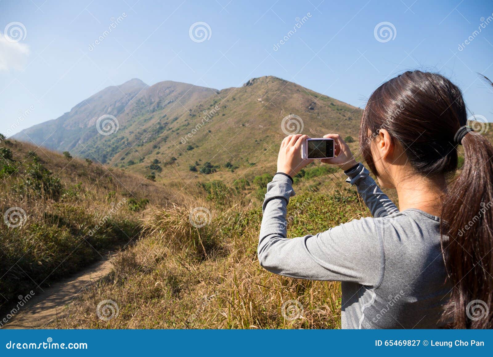 The Back View of Woman Use of Digital Camera Stock Image - Image of ...