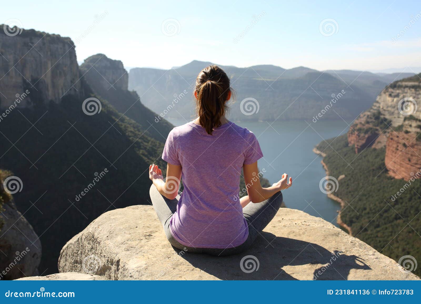 Back View of a Yogi Practicing Yoga on a Cliff Stock Photo - Image of ...
