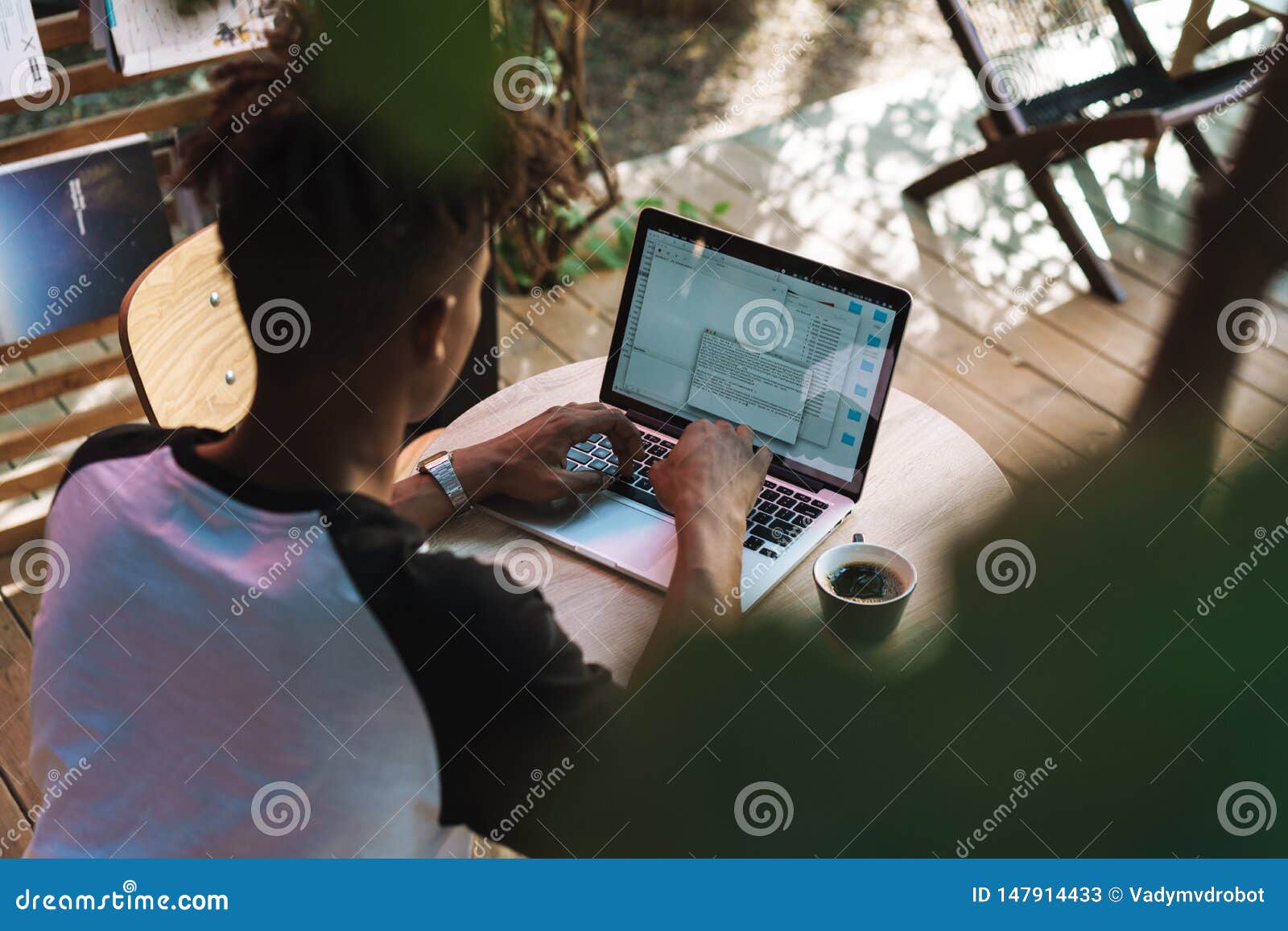 Back View of a Young African Man Using Laptop Computer Stock Image ...
