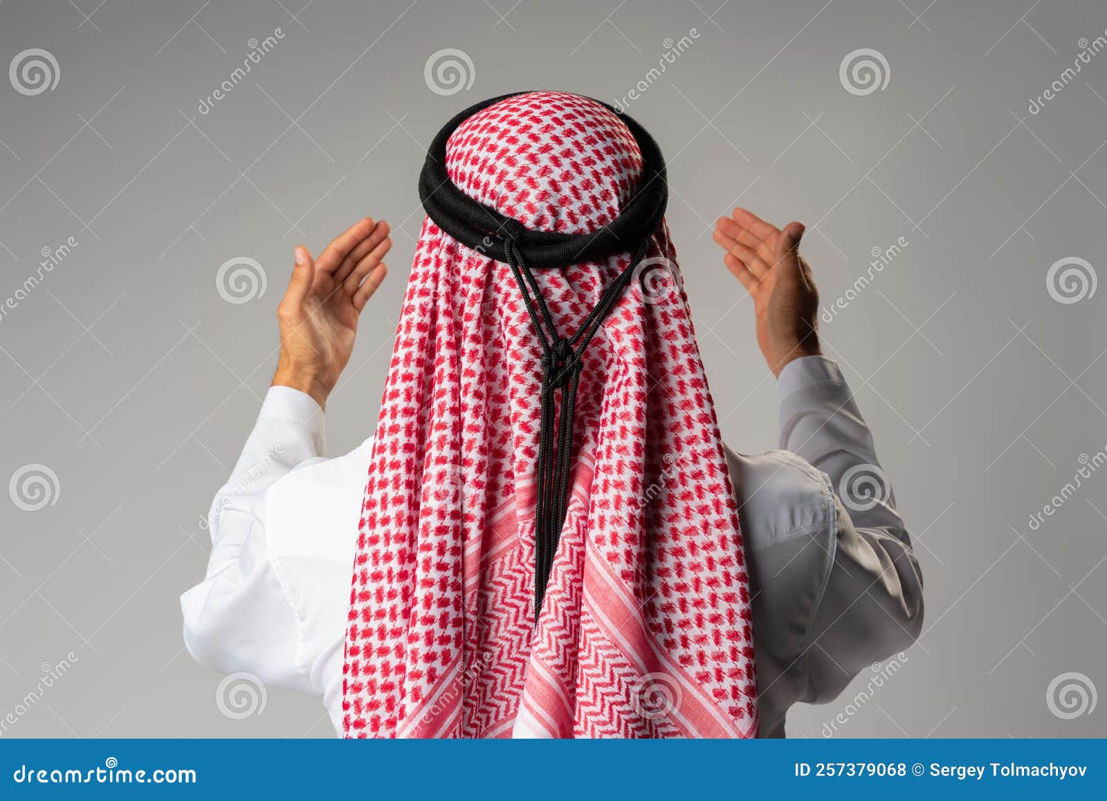 Back View of Young Arab Man Standing on Gray Background Stock Photo ...