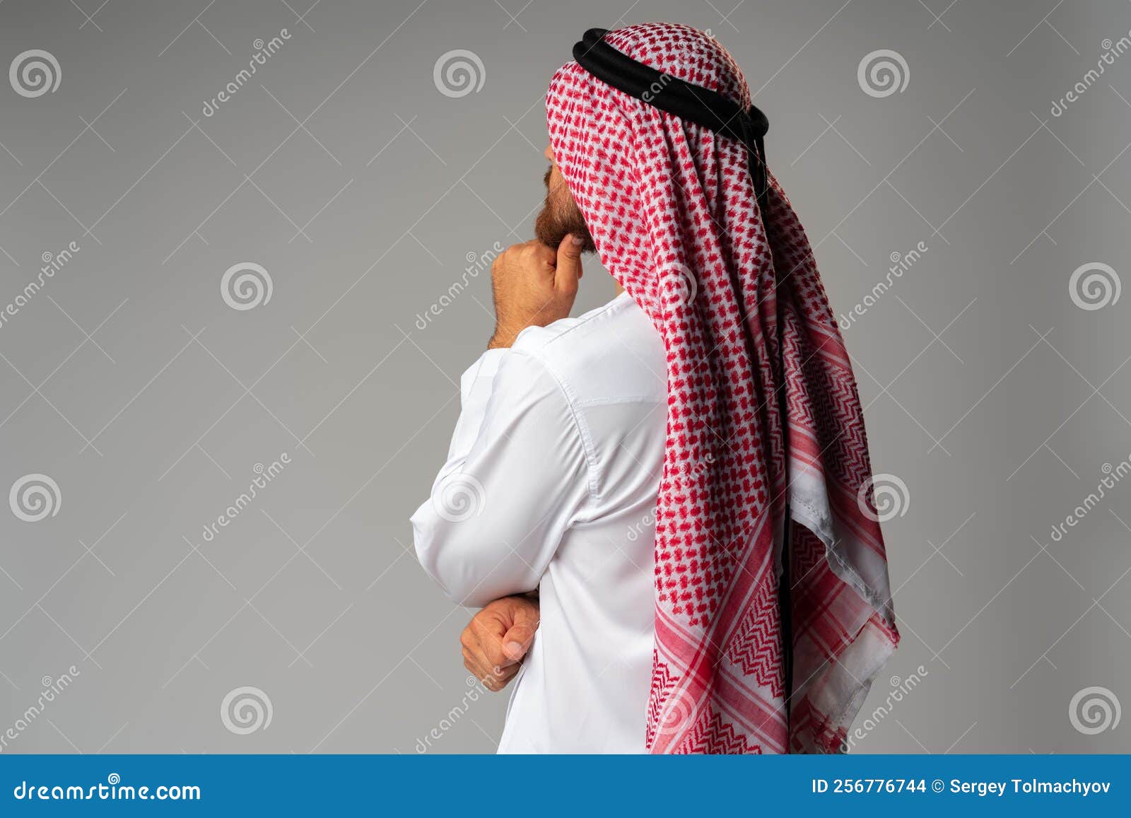 Back View of Young Arab Man Standing on Gray Background Stock Photo ...