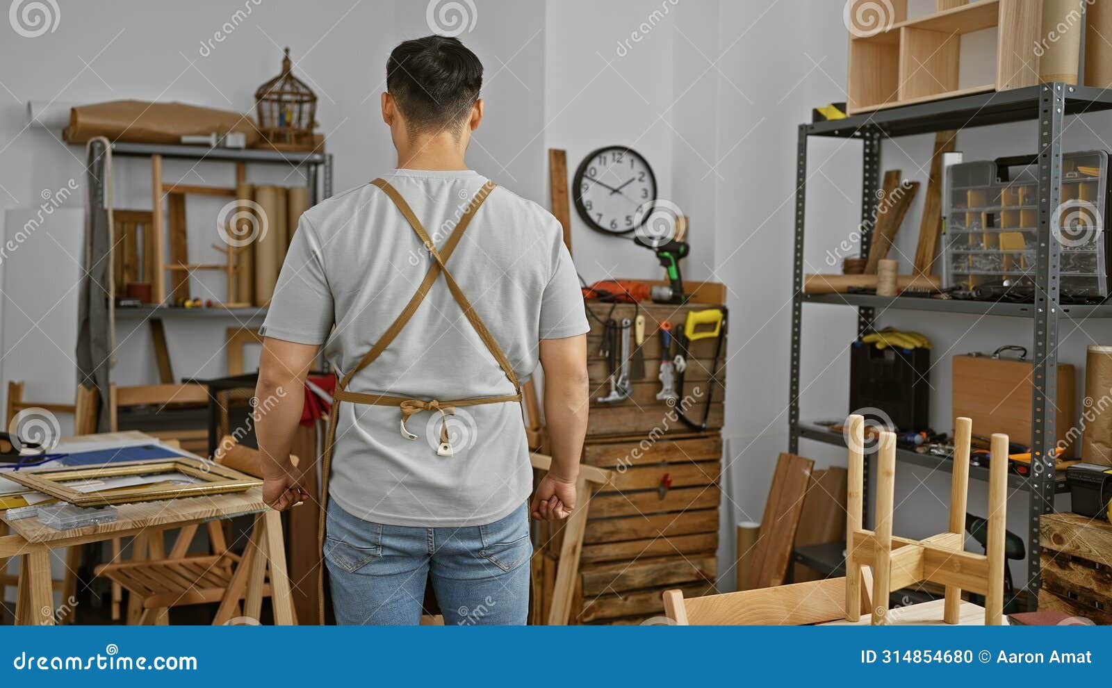 Back View of a Young Asian Man Standing Thoughtfully in a Well ...