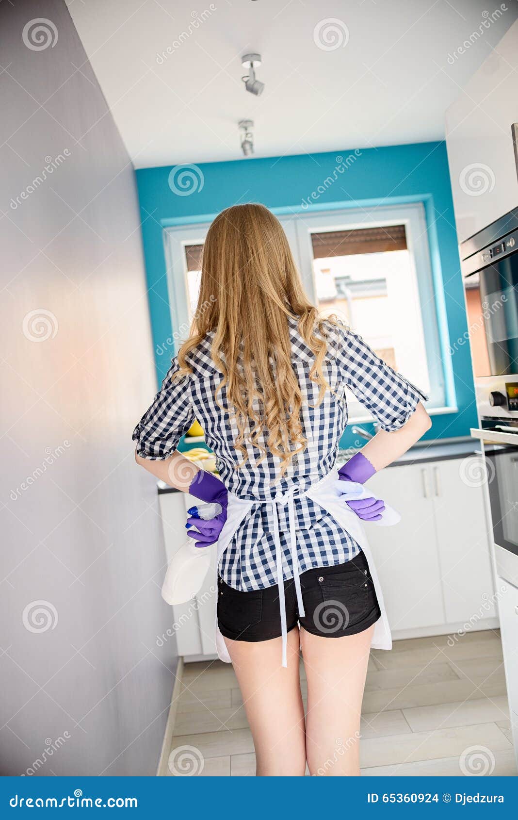 Back View of Young Blond Woman Getting Ready for Cleaning Stock Photo ...