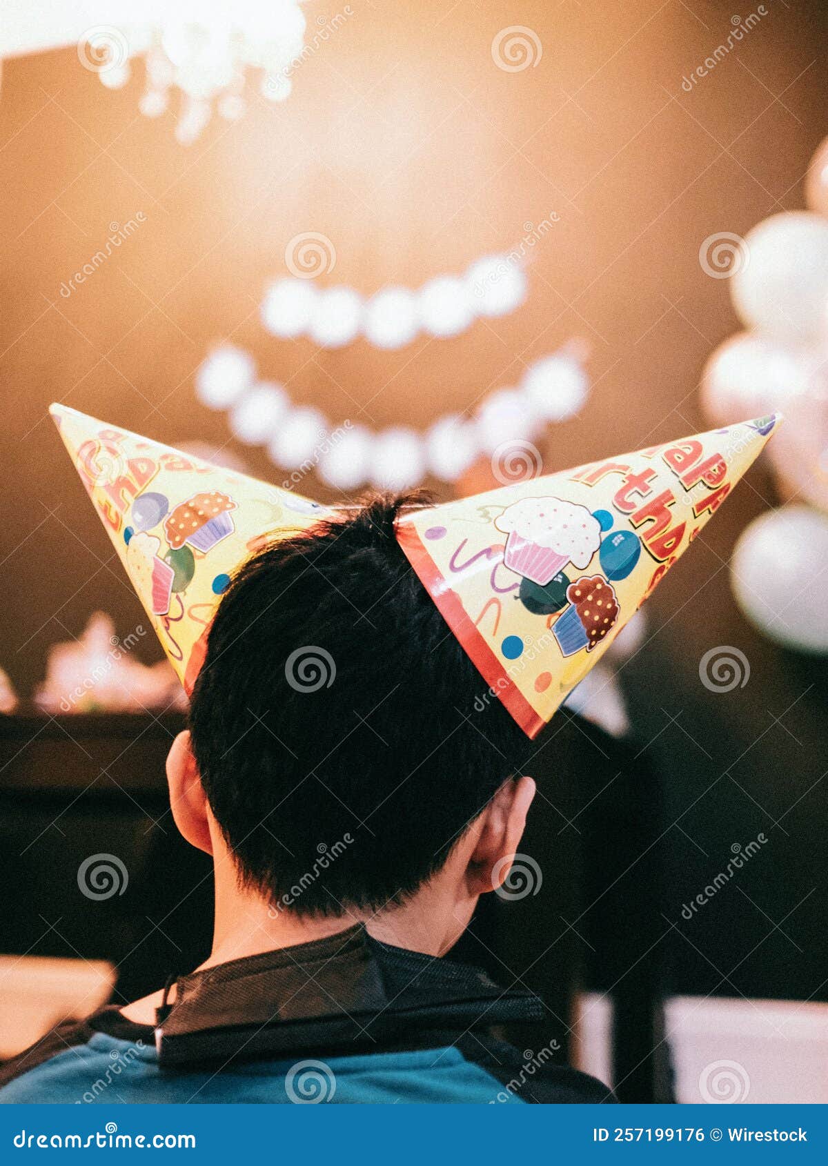 Back View of a Young Boy with Party Hats Stock Photo - Image of ...