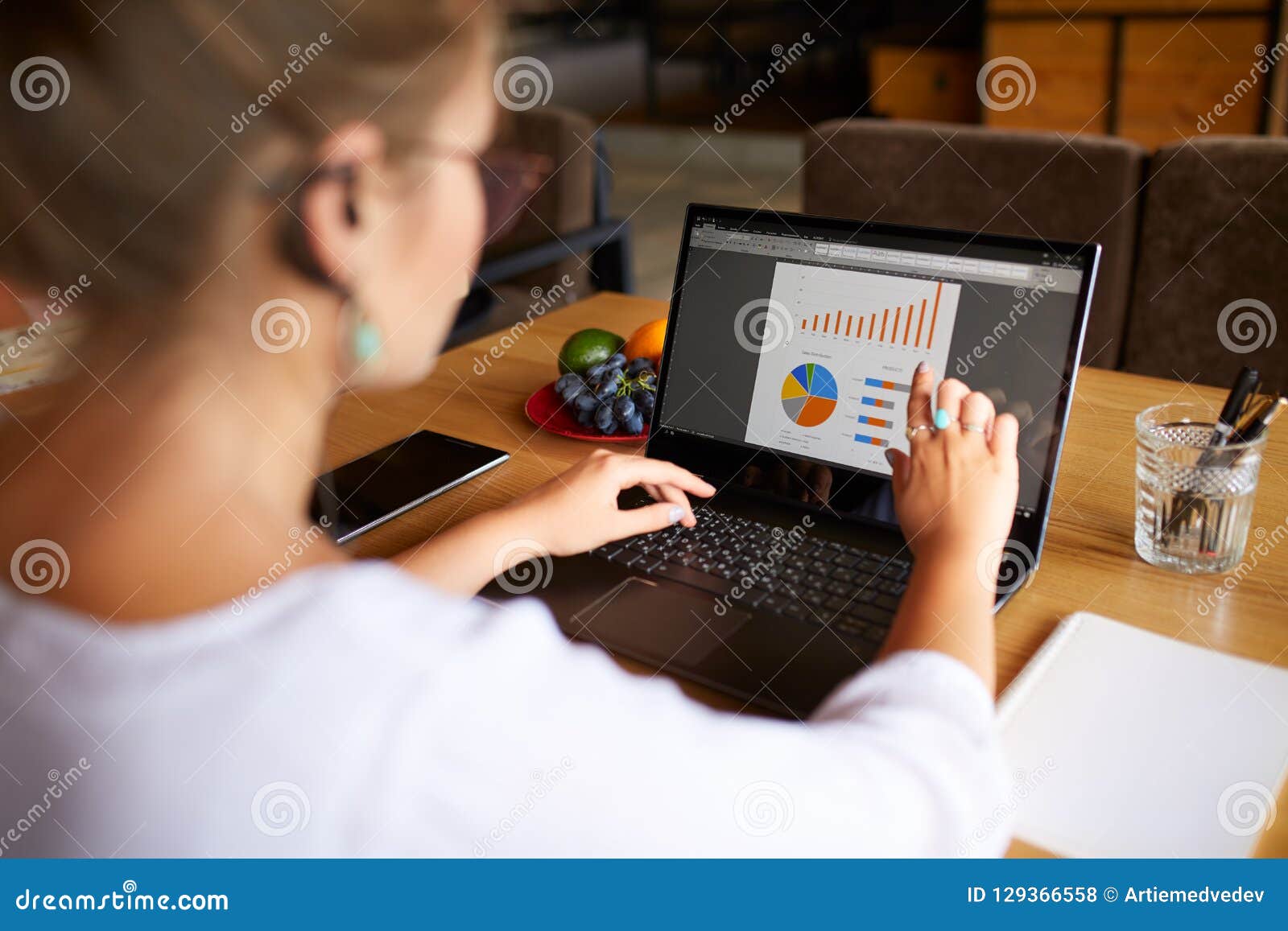 Back View of Young Business or Student Woman Working at Cafe with ...