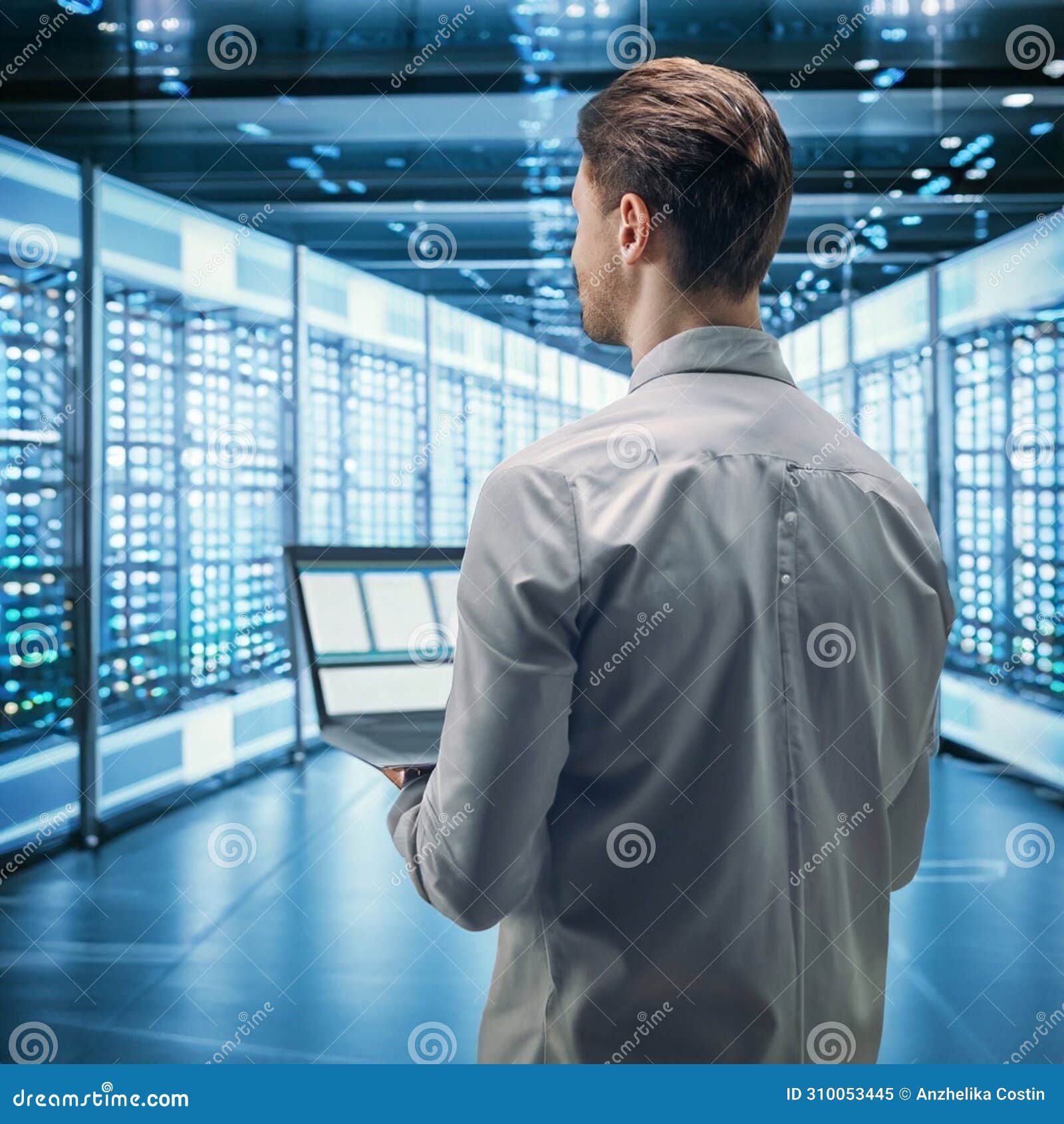 Back View of Young Businessman in Shiny Server Room. Technology Concept ...