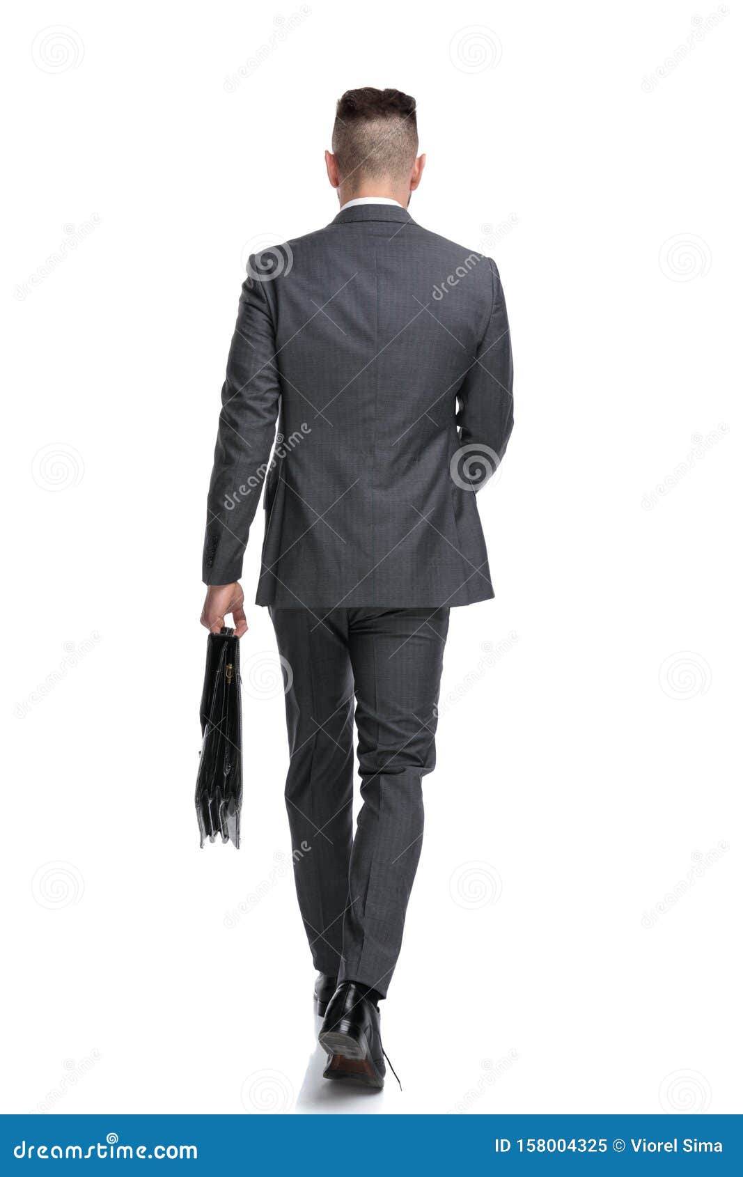 Back View of a Young Businessman Walking Forward Stock Image - Image of ...