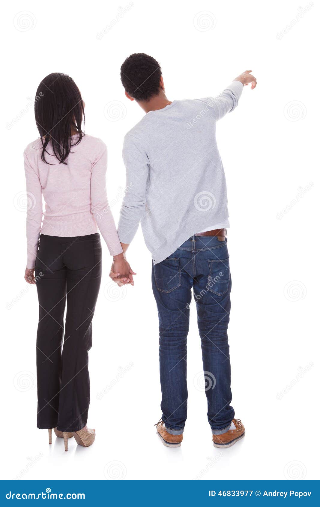 Back View of Young Couple Pointing Stock Image - Image of friendship ...