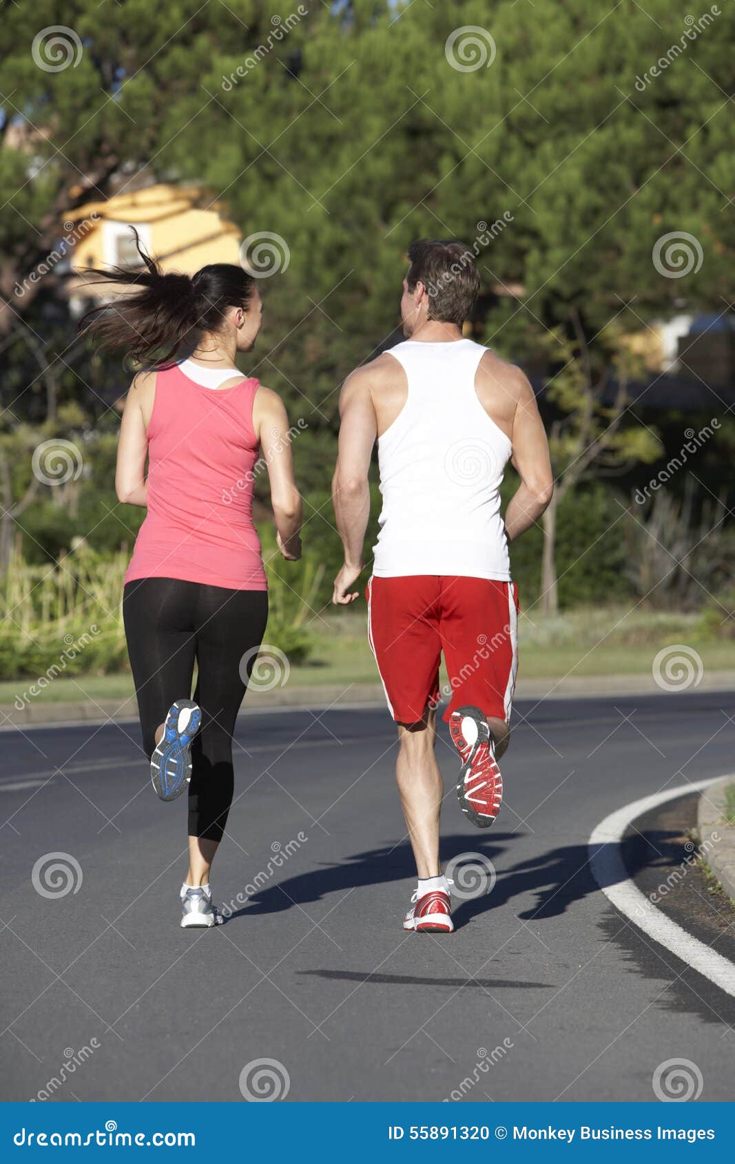 Back View of Young Couple Running on Road Stock Photo - Image of ...