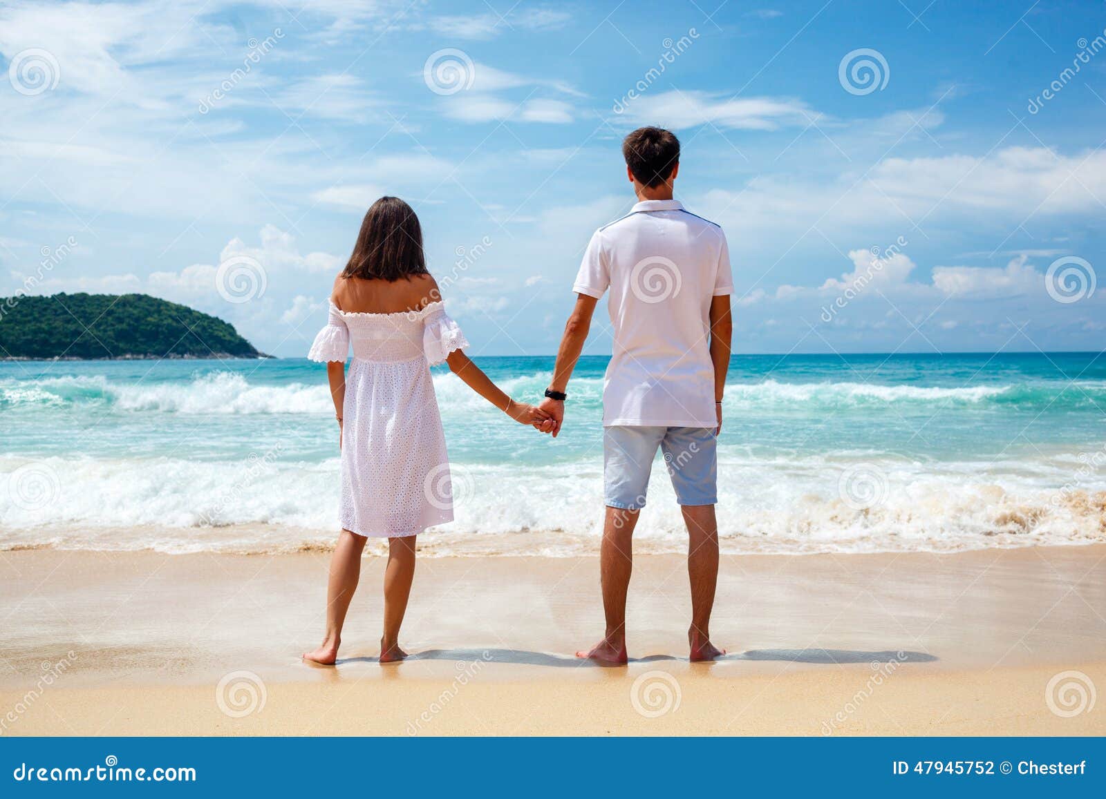 Back View of Young Couple Standing on Sandy Beach Stock Photo - Image ...