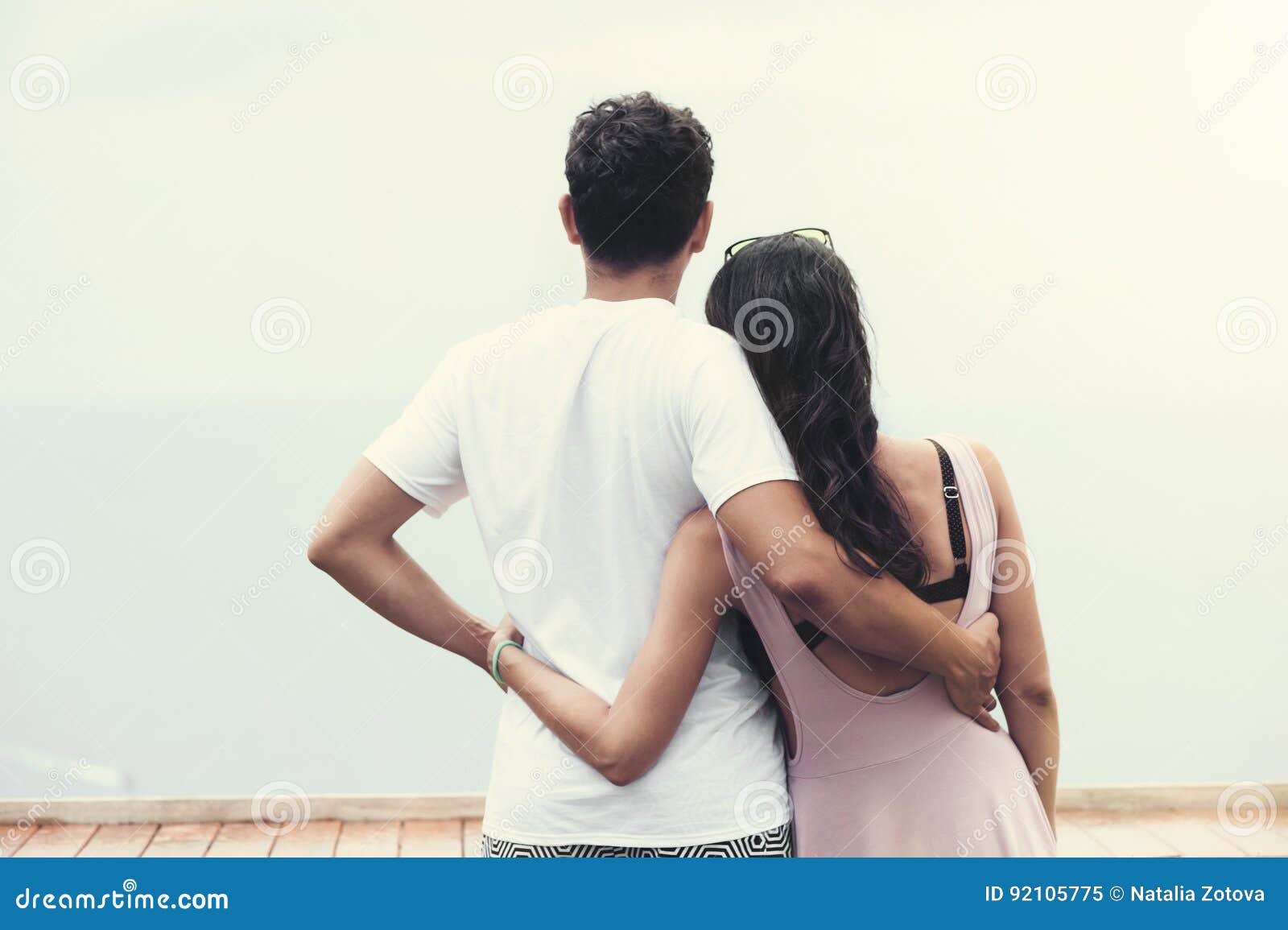 Back View of Young Couple Standing at the Top and Watching Seaview ...