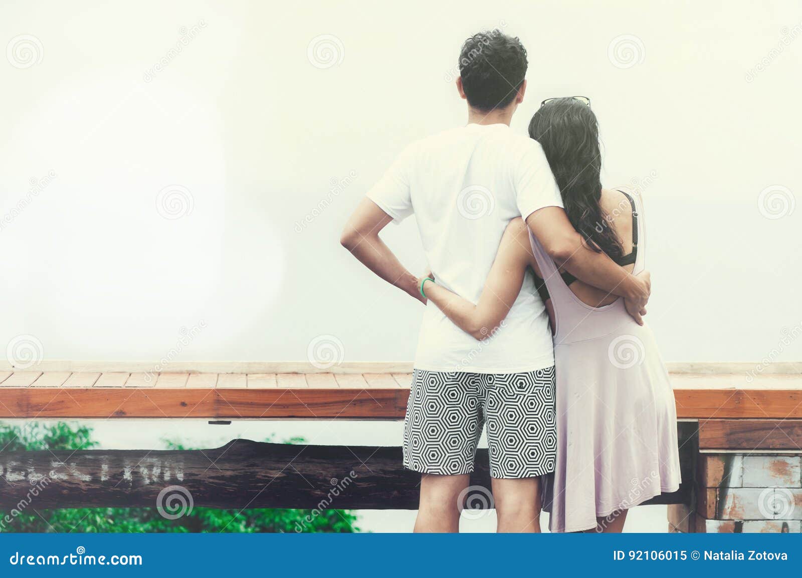 Back View of Young Couple Standing at the Top and Watching Seaview ...