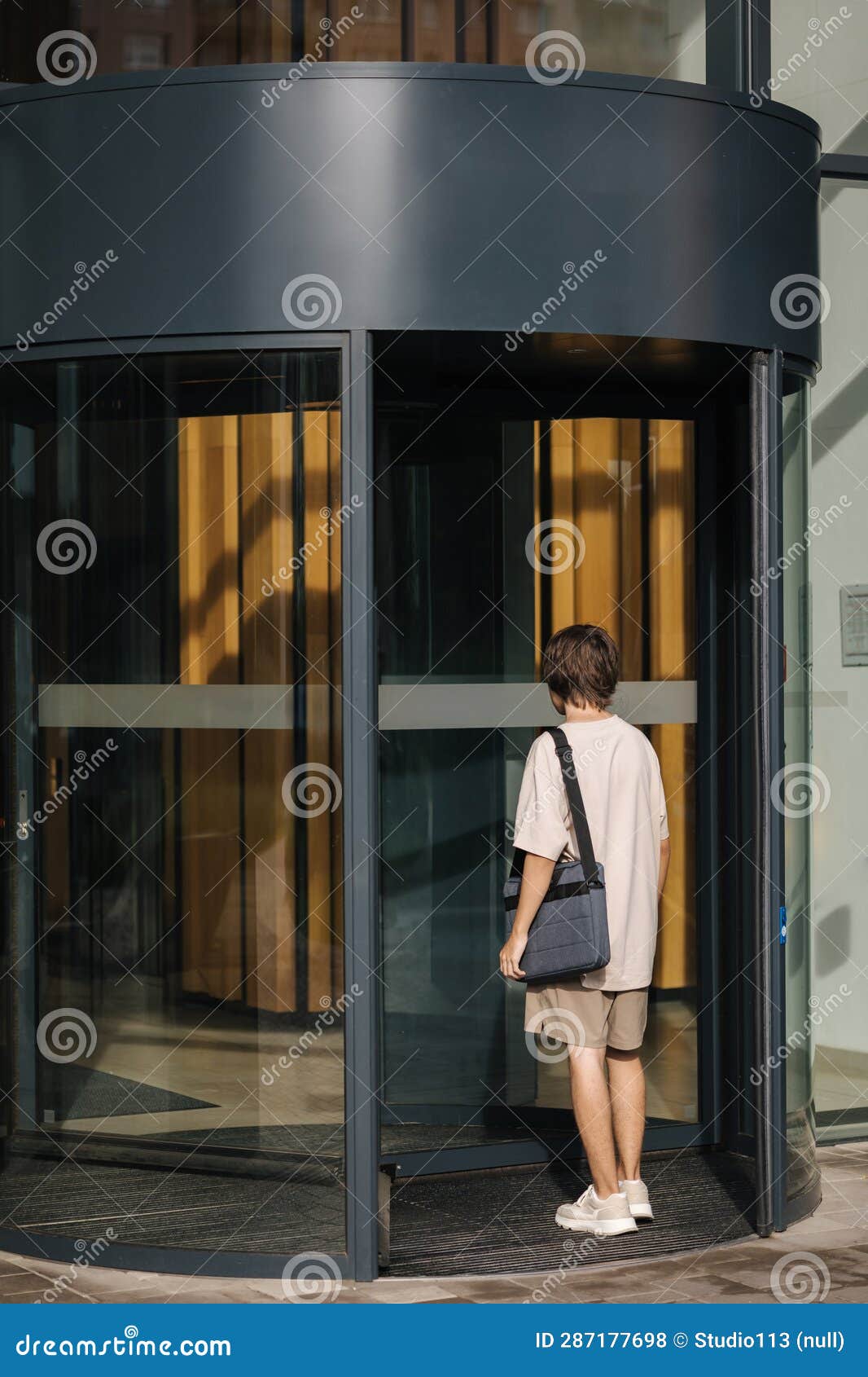 Back View of Young Delivery Boy Come Inside the Business Centre for ...