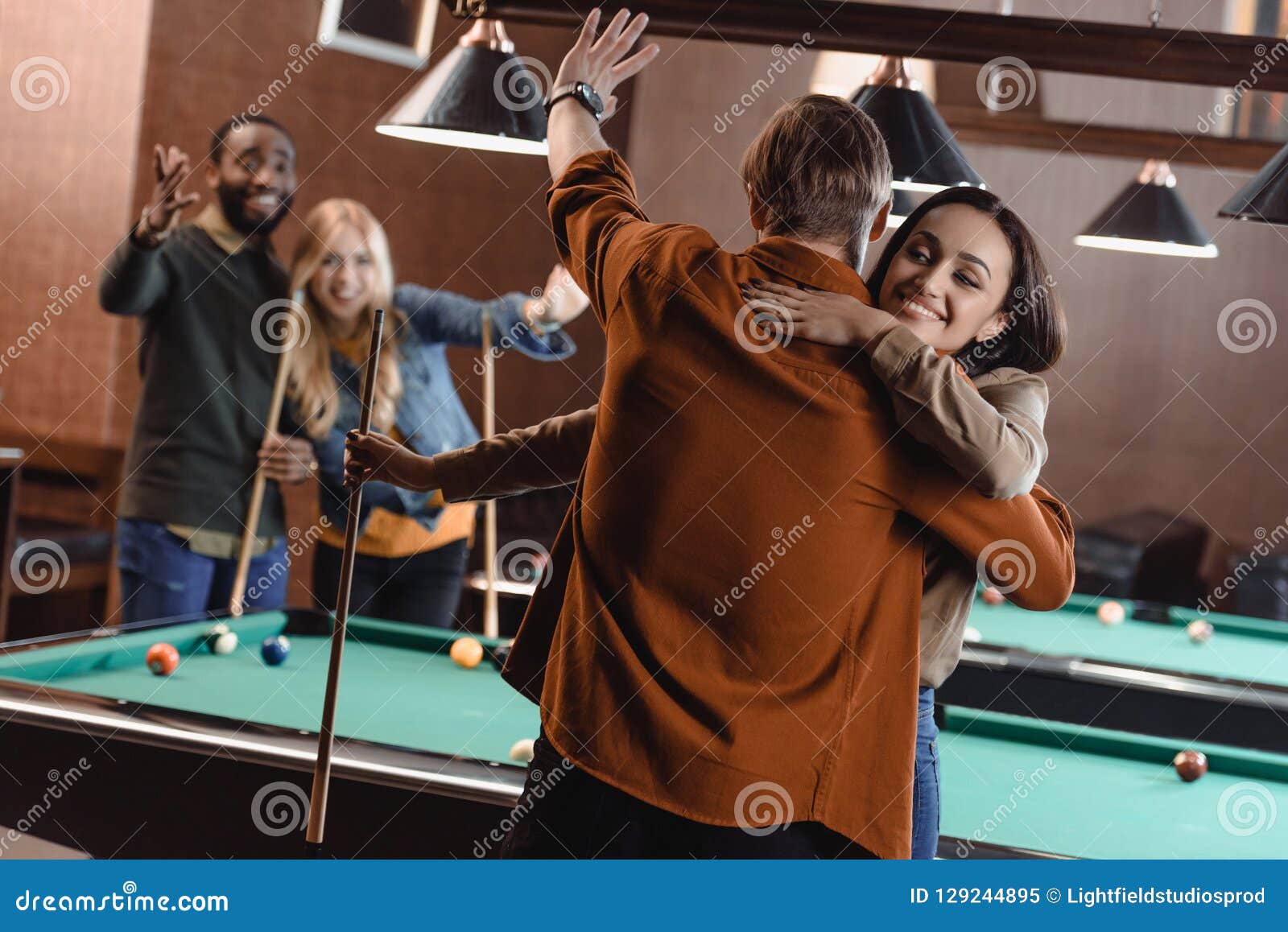 Back View of Young Friends Hugging beside Pool Table Stock Image ...