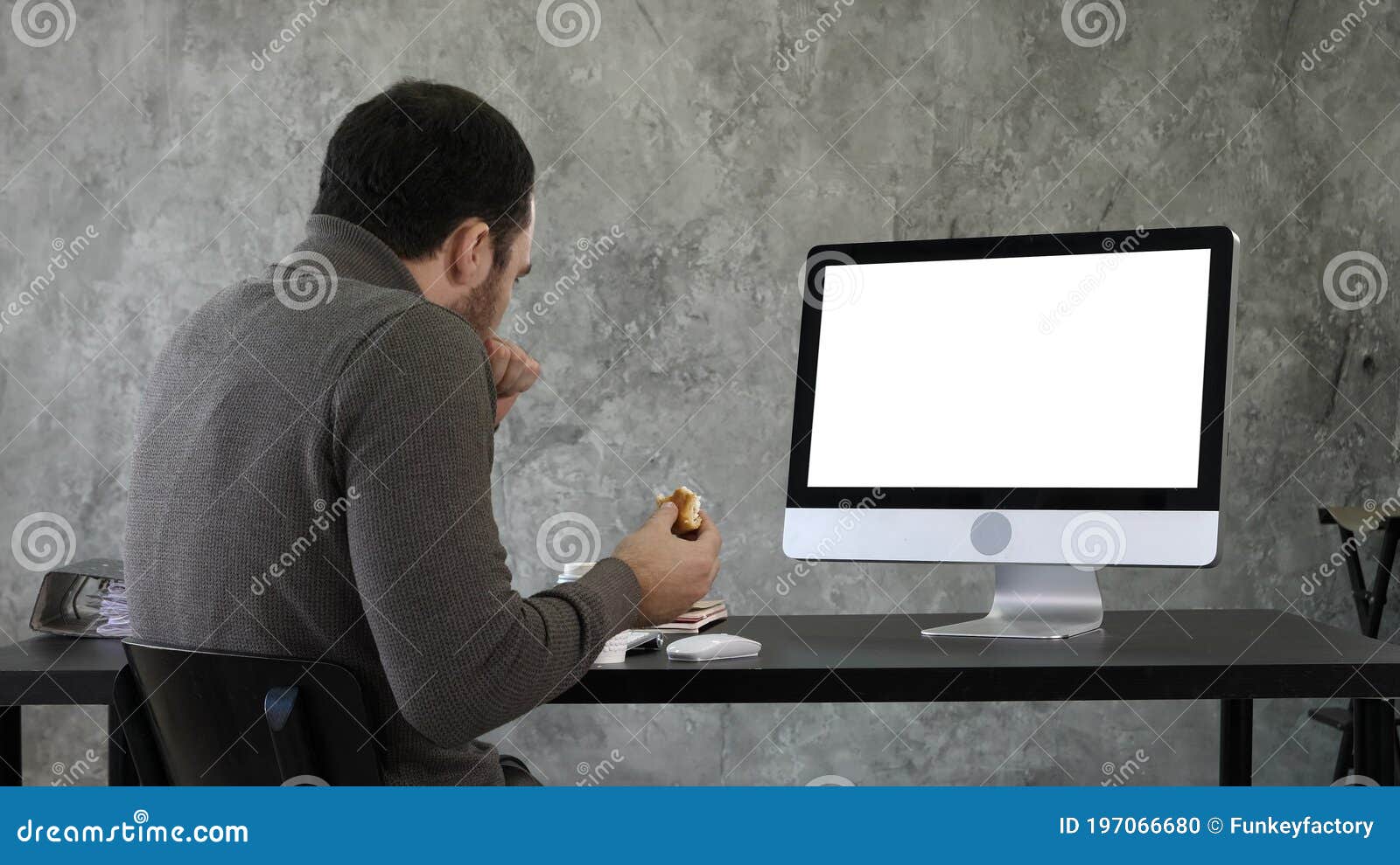 Young Man Choking while Eating and Watching Something on the Com Stock ...